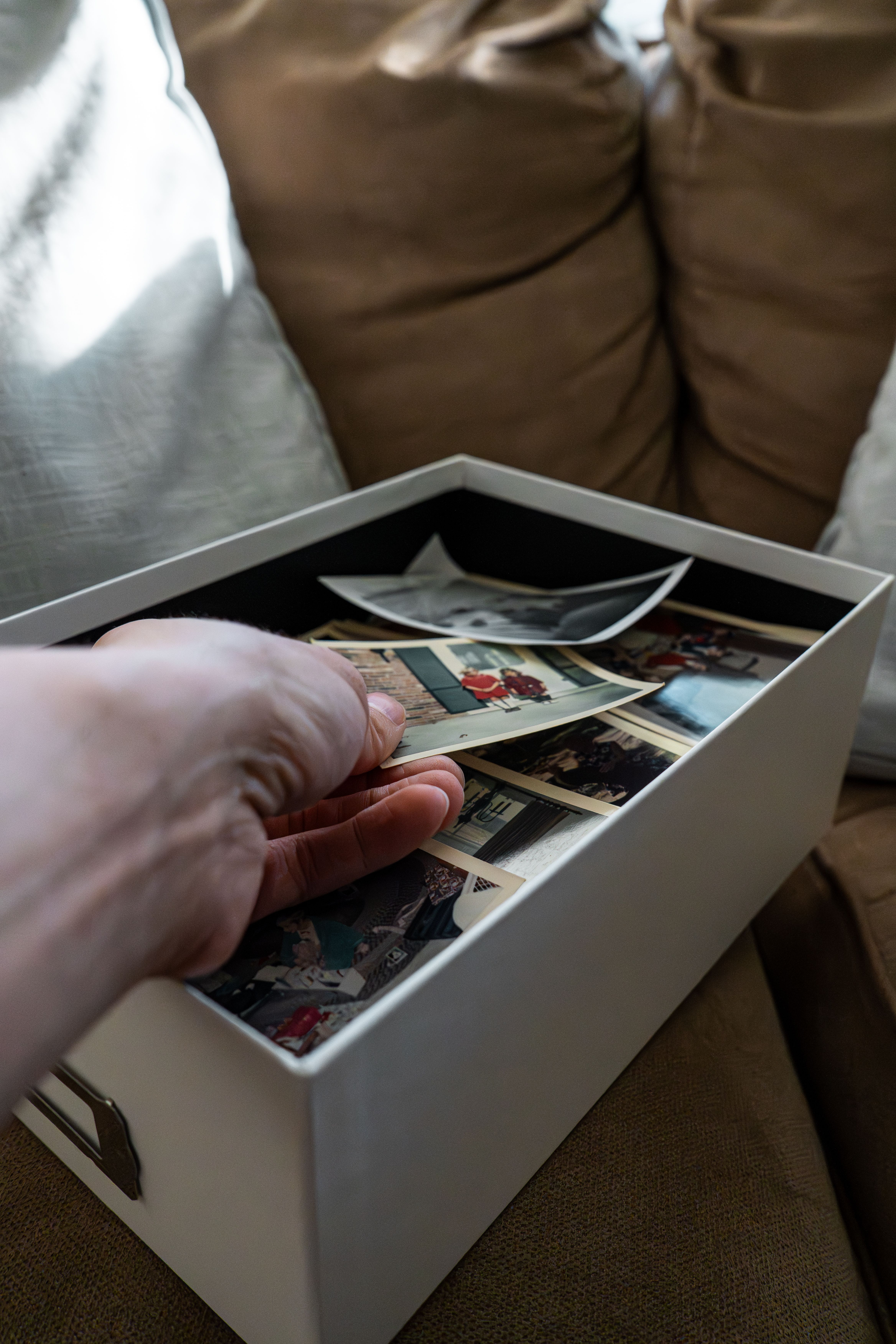 Discovering Nostalgic Family Memories in a Shoebox · Free Stock Photo