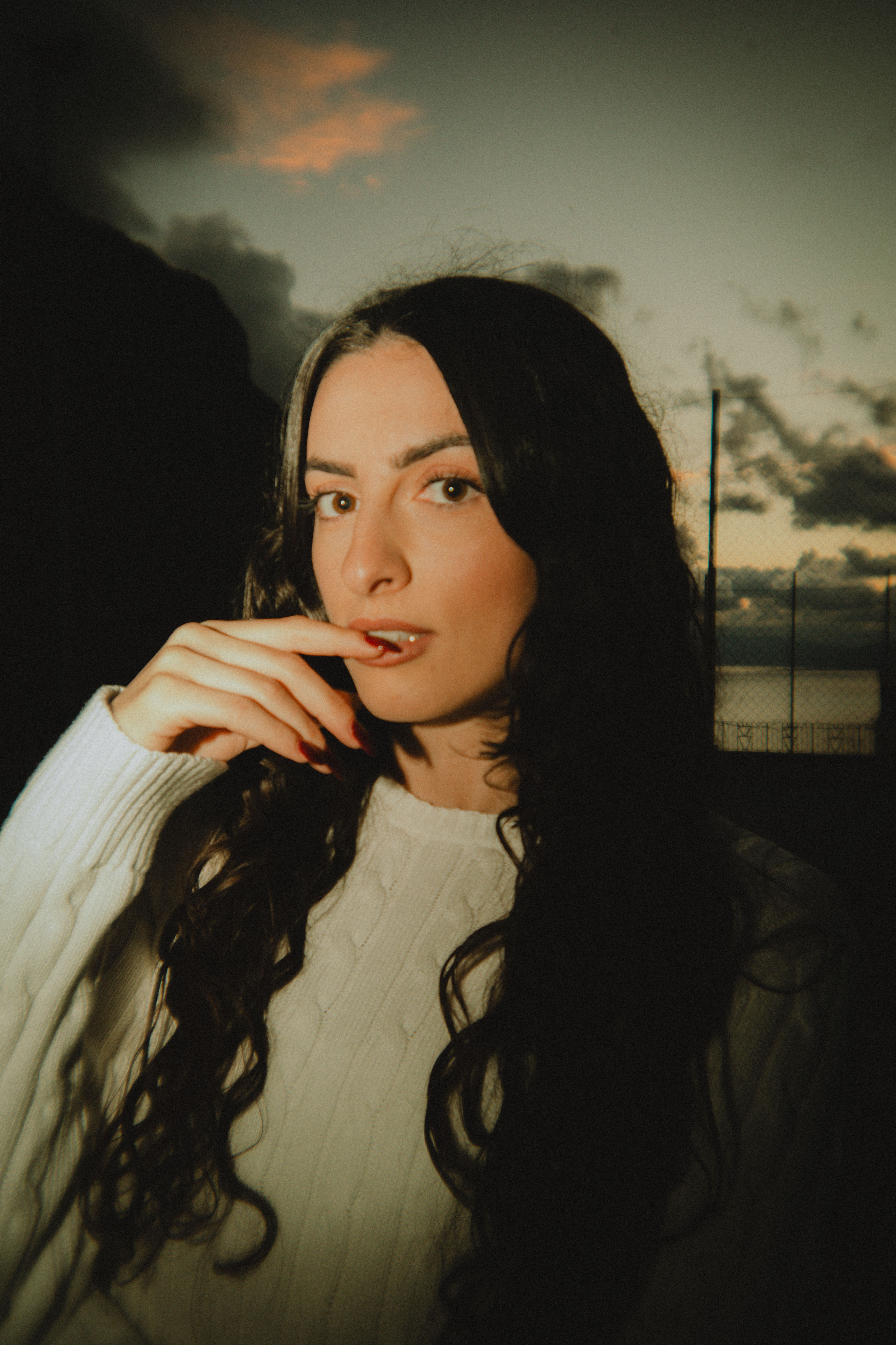 Moody Portrait of Woman at Dusk Outdoors · Free Stock Photo