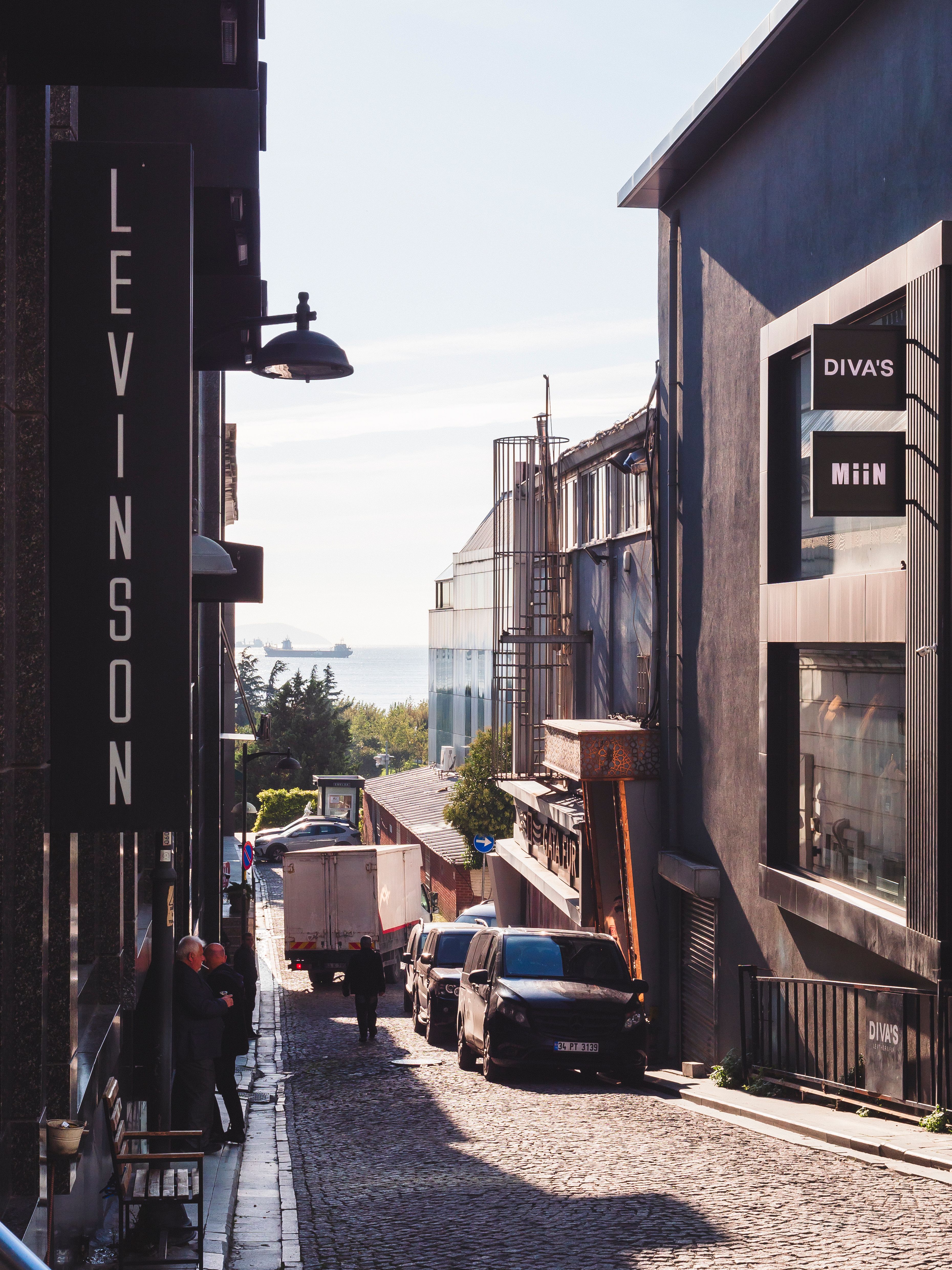 Cobbled Urban Street with Ocean View · Free Stock Photo