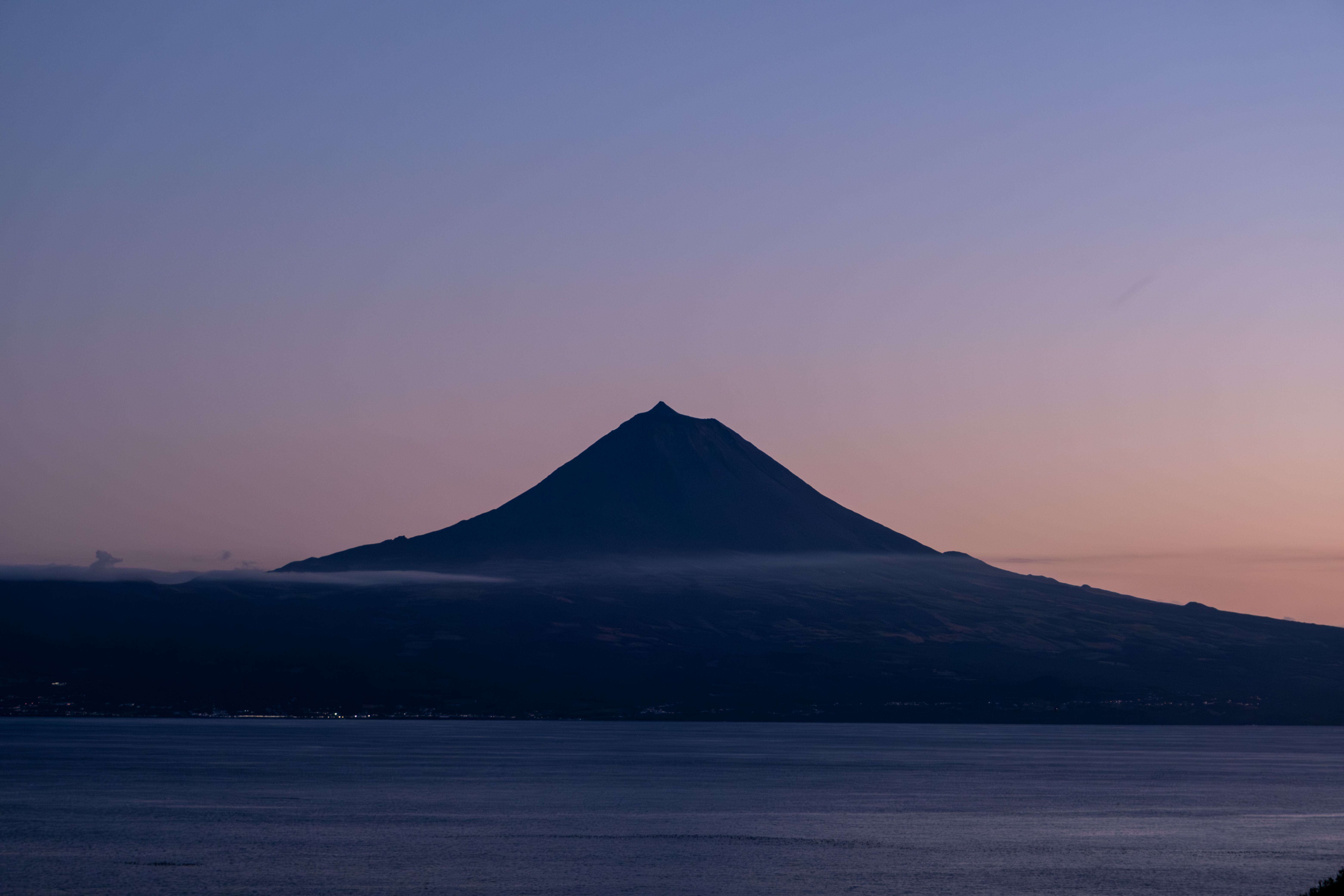 Majestic Volcano at Dusk over Calm Ocean · Free Stock Photo