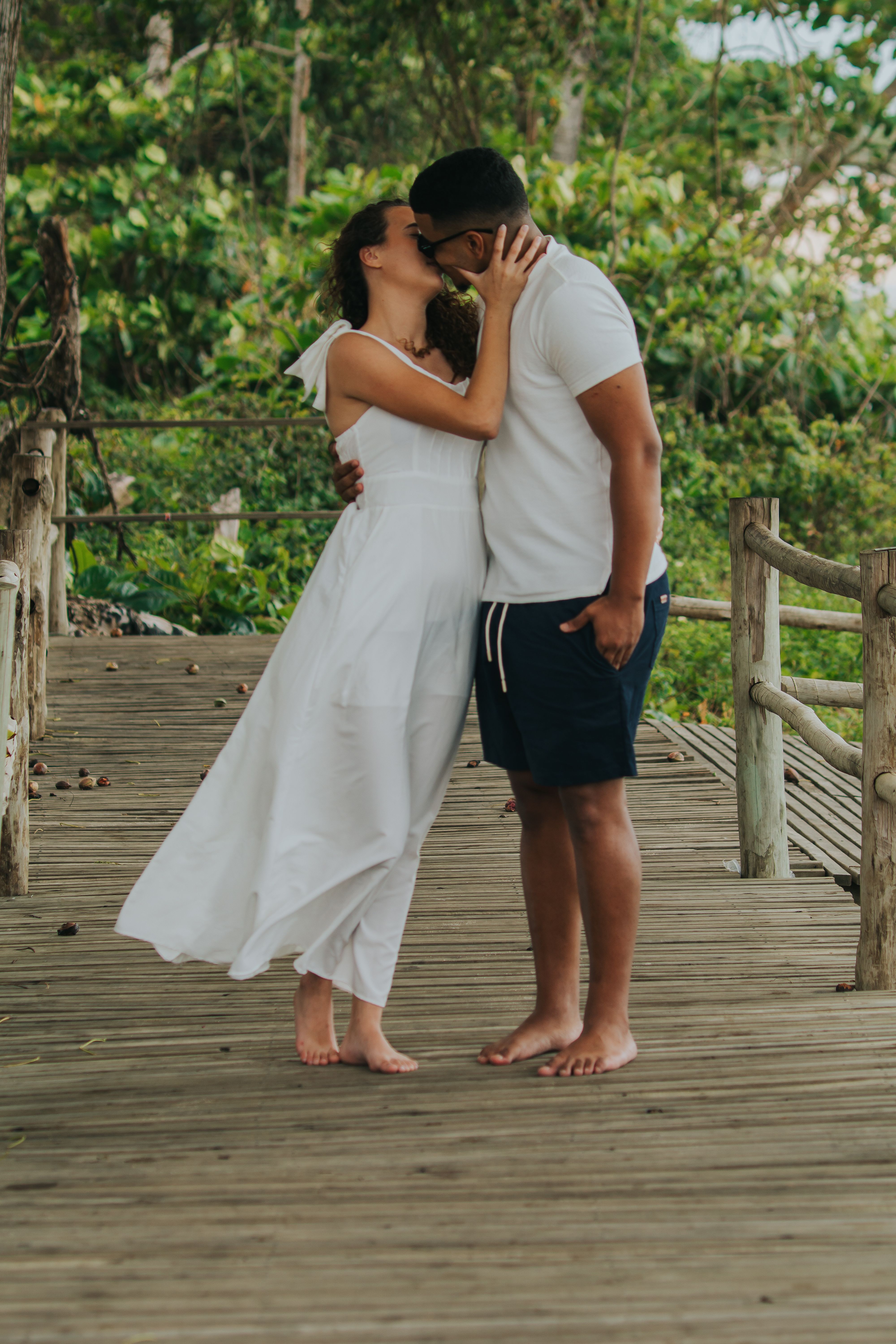 Man Holding His Partner and Kissing Her on the Cheek · Free Stock Photo
