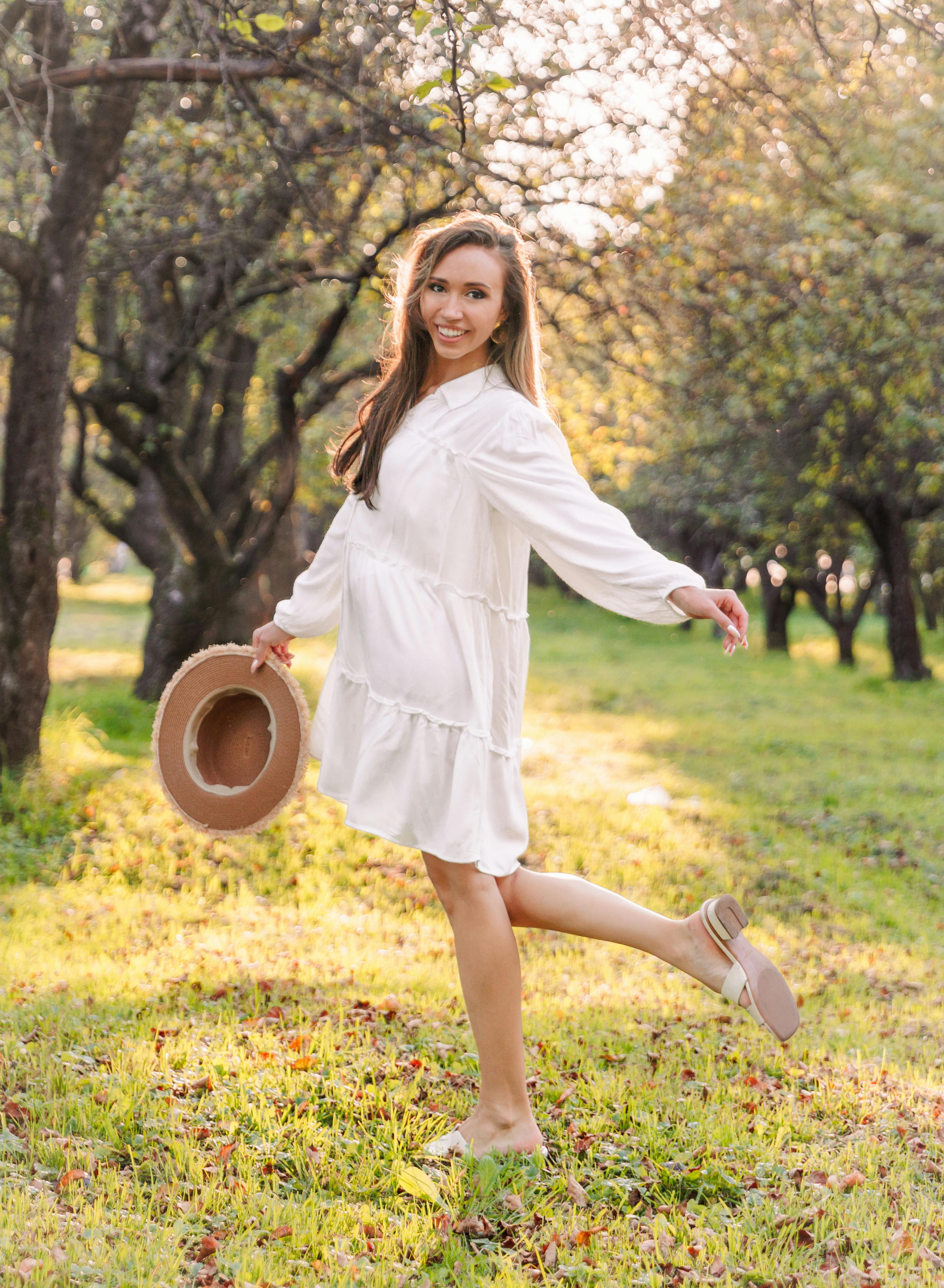 Woman Standing Near Trees · Free Stock Photo
