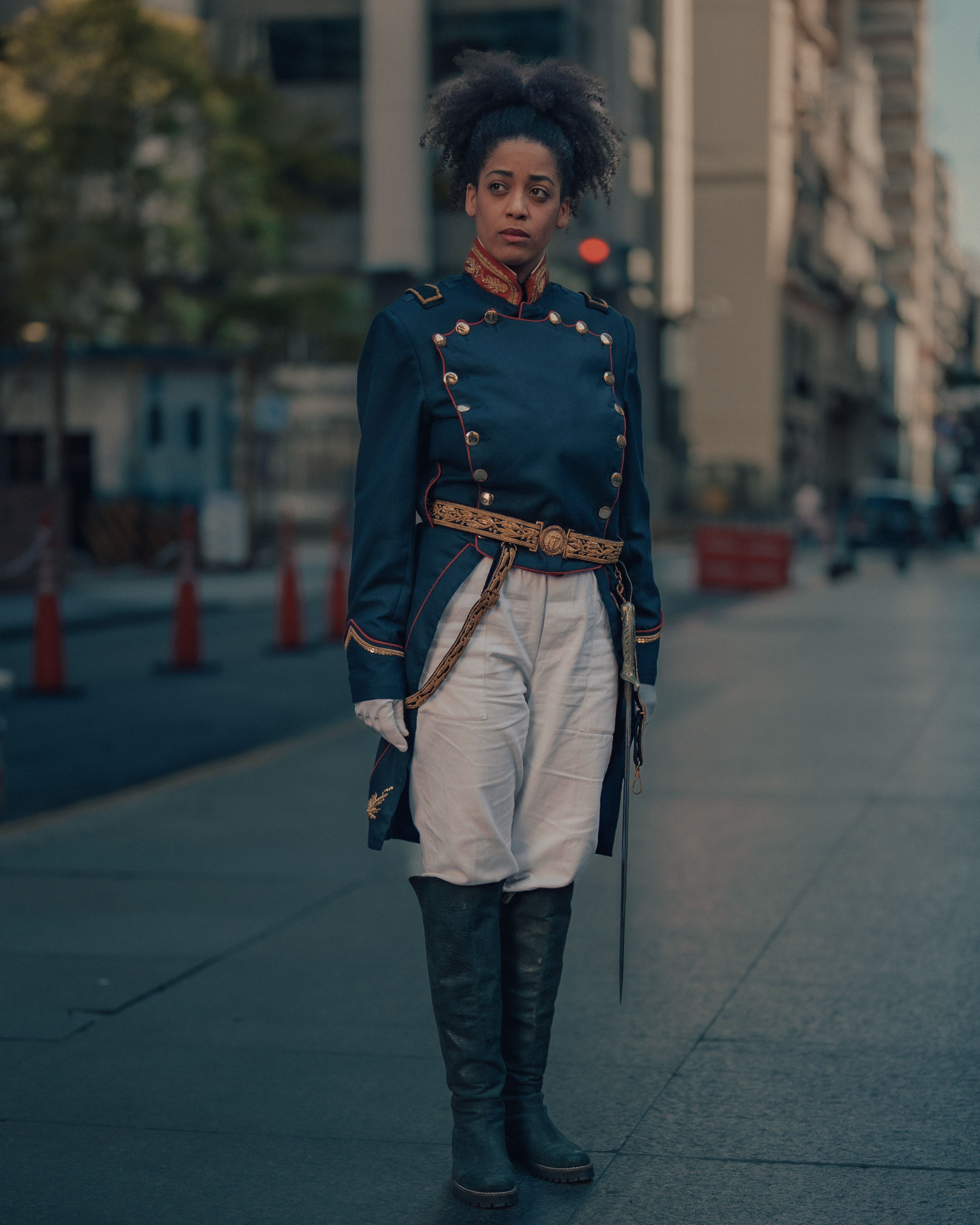 Woman in Historical Uniform Standing on Urban Street · Free Stock Photo