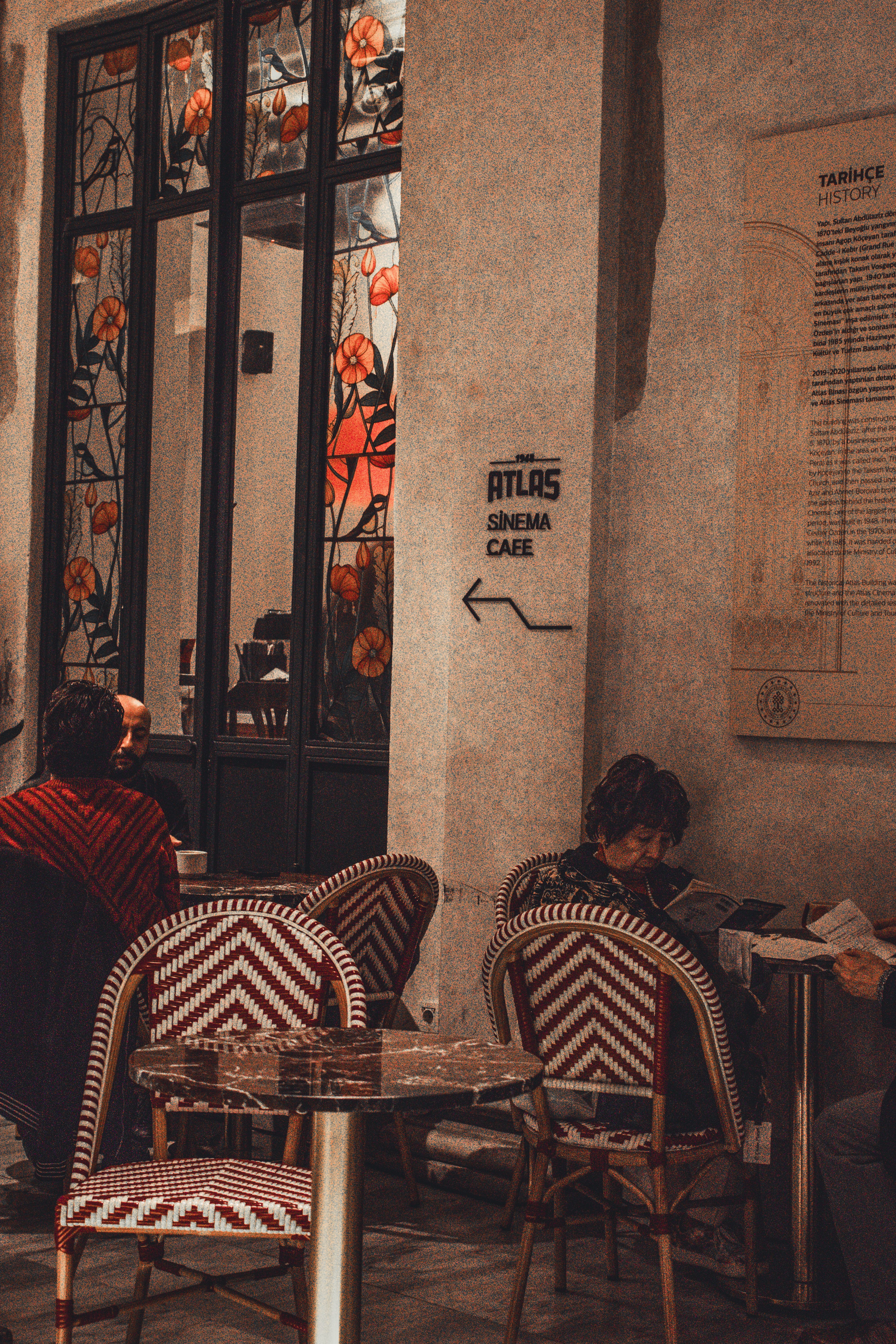 Cozy Cafe Scene with Stained Glass Windows · Free Stock Photo