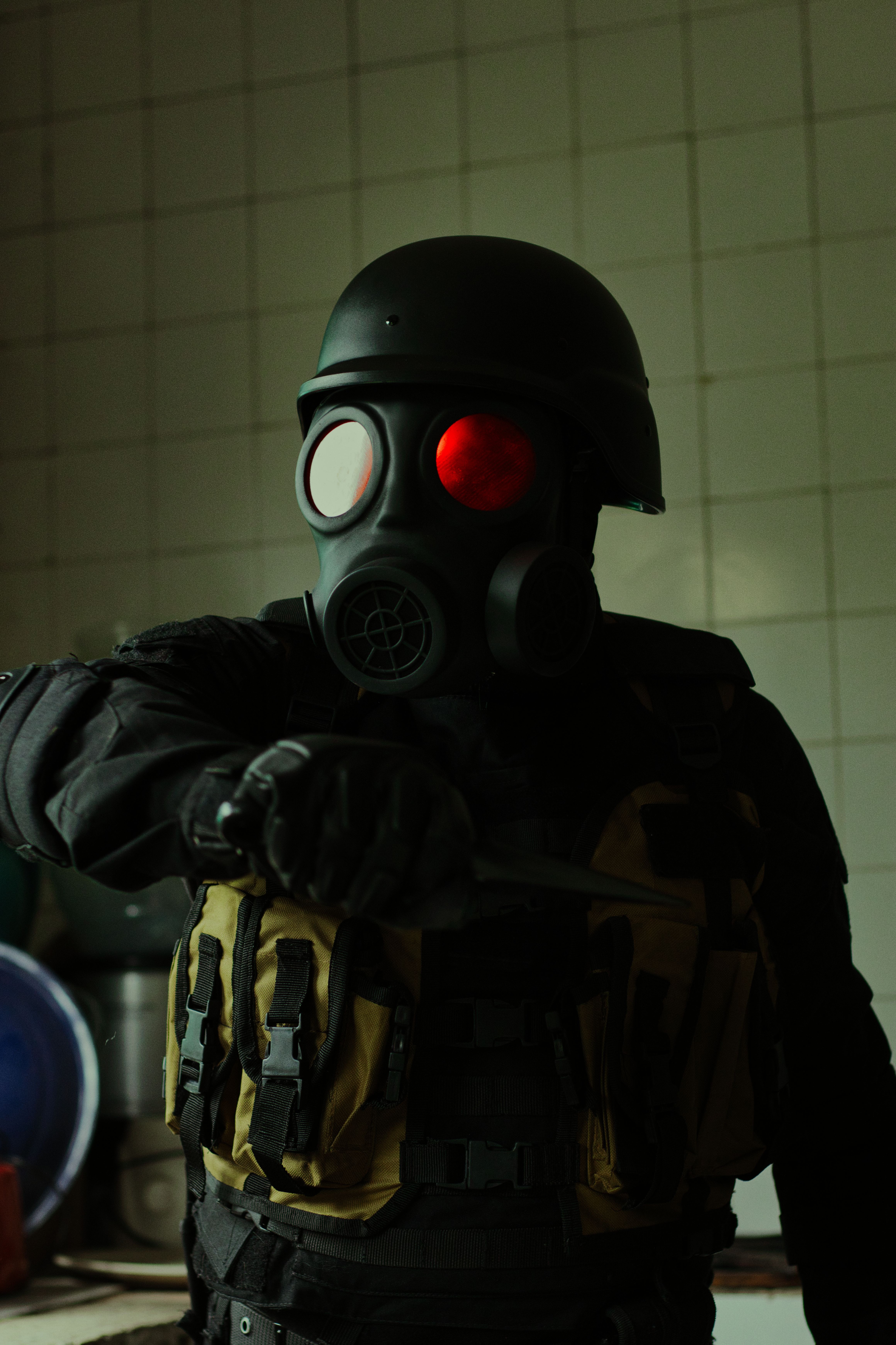 Gas Masked Figure in a Tactical Suit · Free Stock Photo