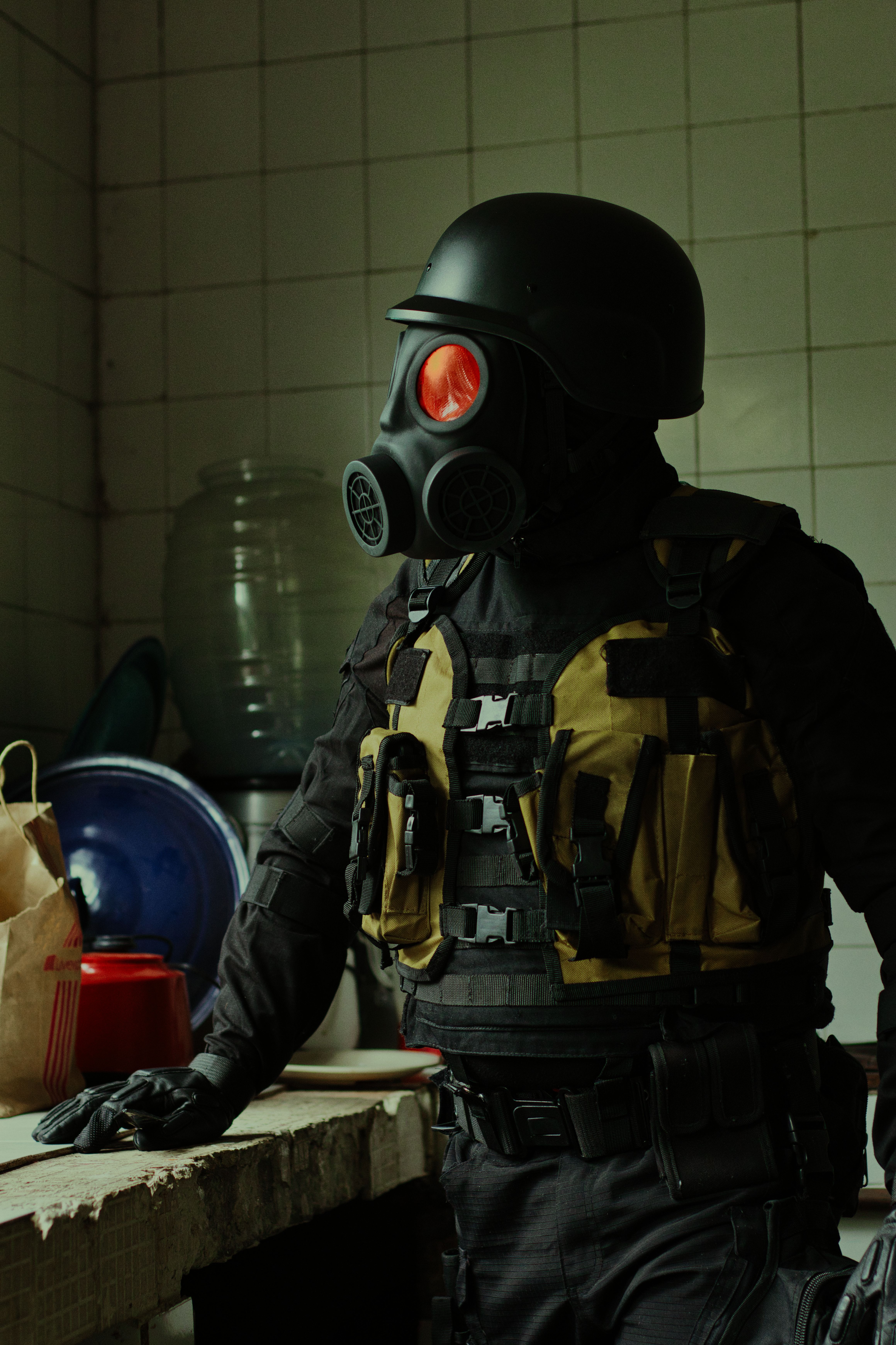 Person in Gas Mask and Tactical Gear Indoors · Free Stock Photo