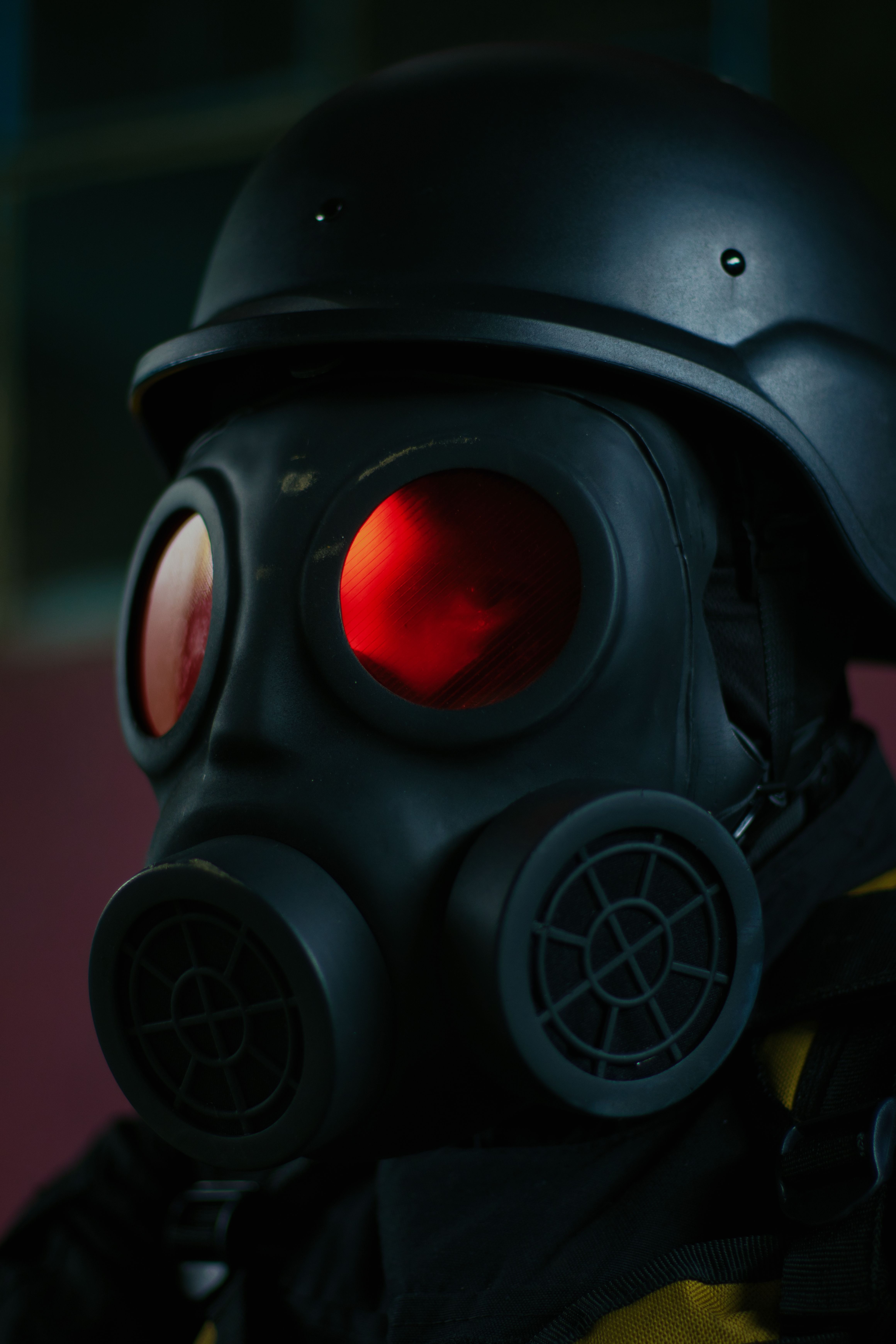 Mysterious Figure in Red-Tinted Gas Mask · Free Stock Photo