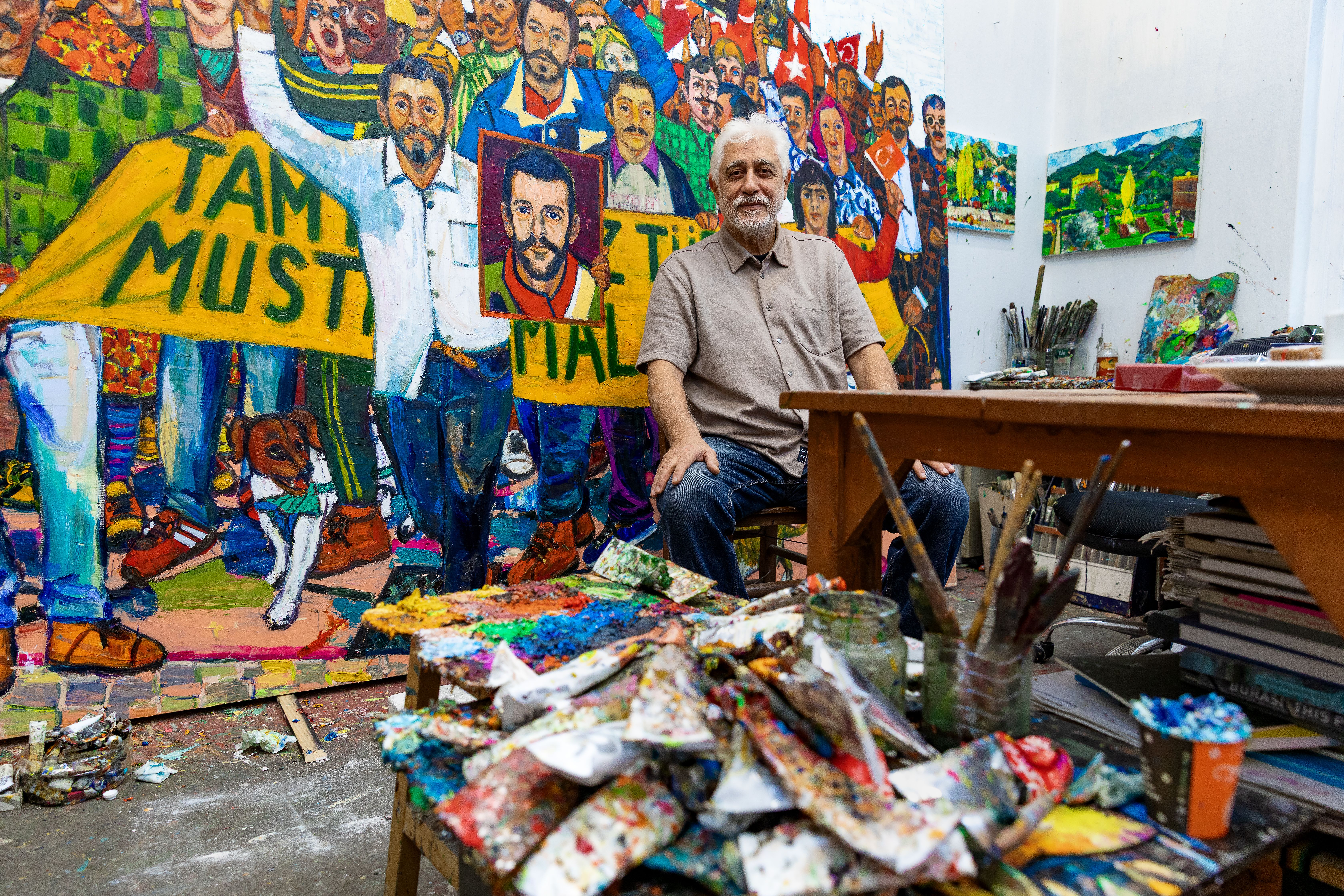Colorful Studio Art Scene with Painter in Gallery · Free Stock Photo