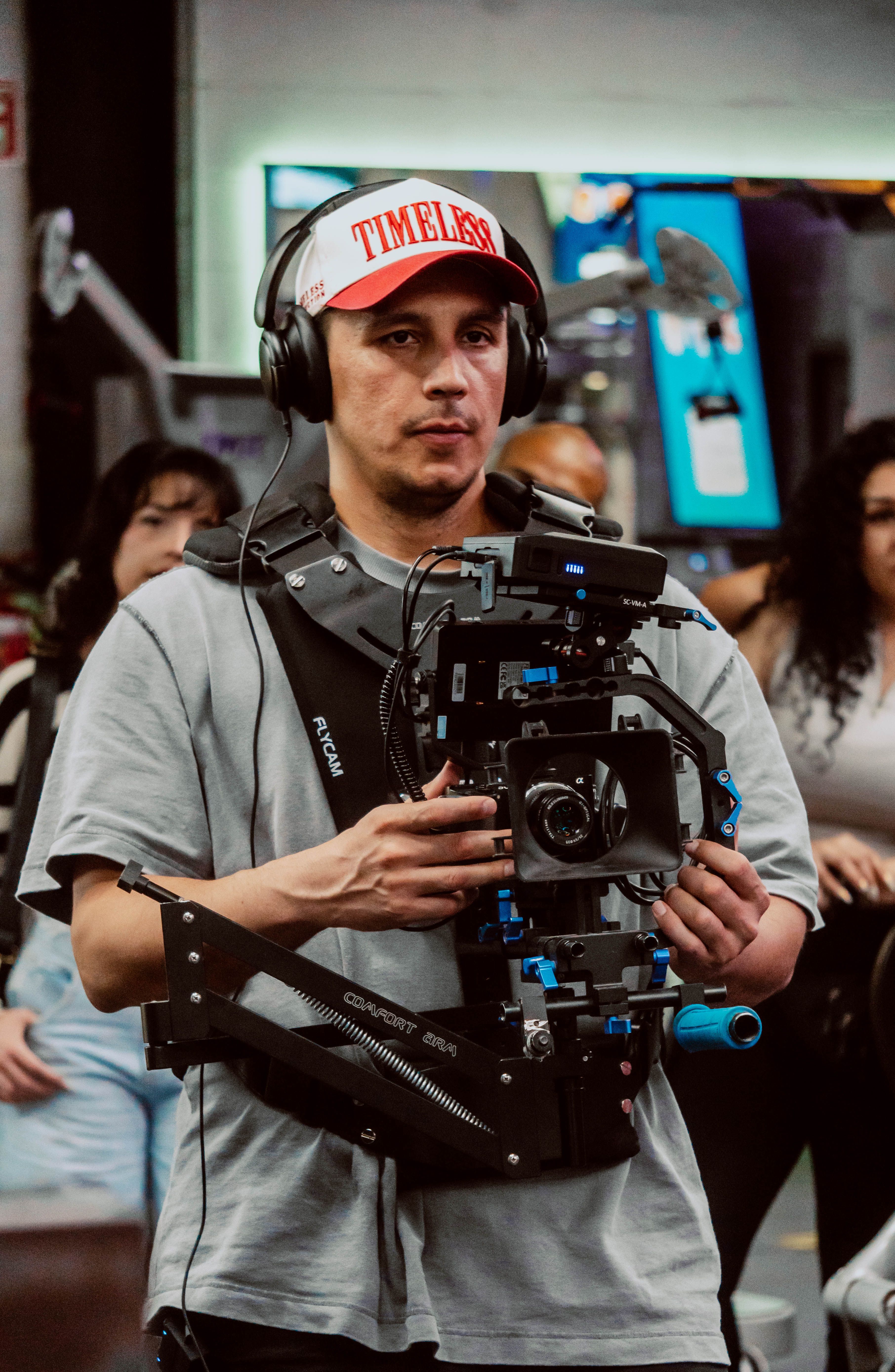 Cameraman Operating a Professional Steadicam Rig · Free Stock Photo
