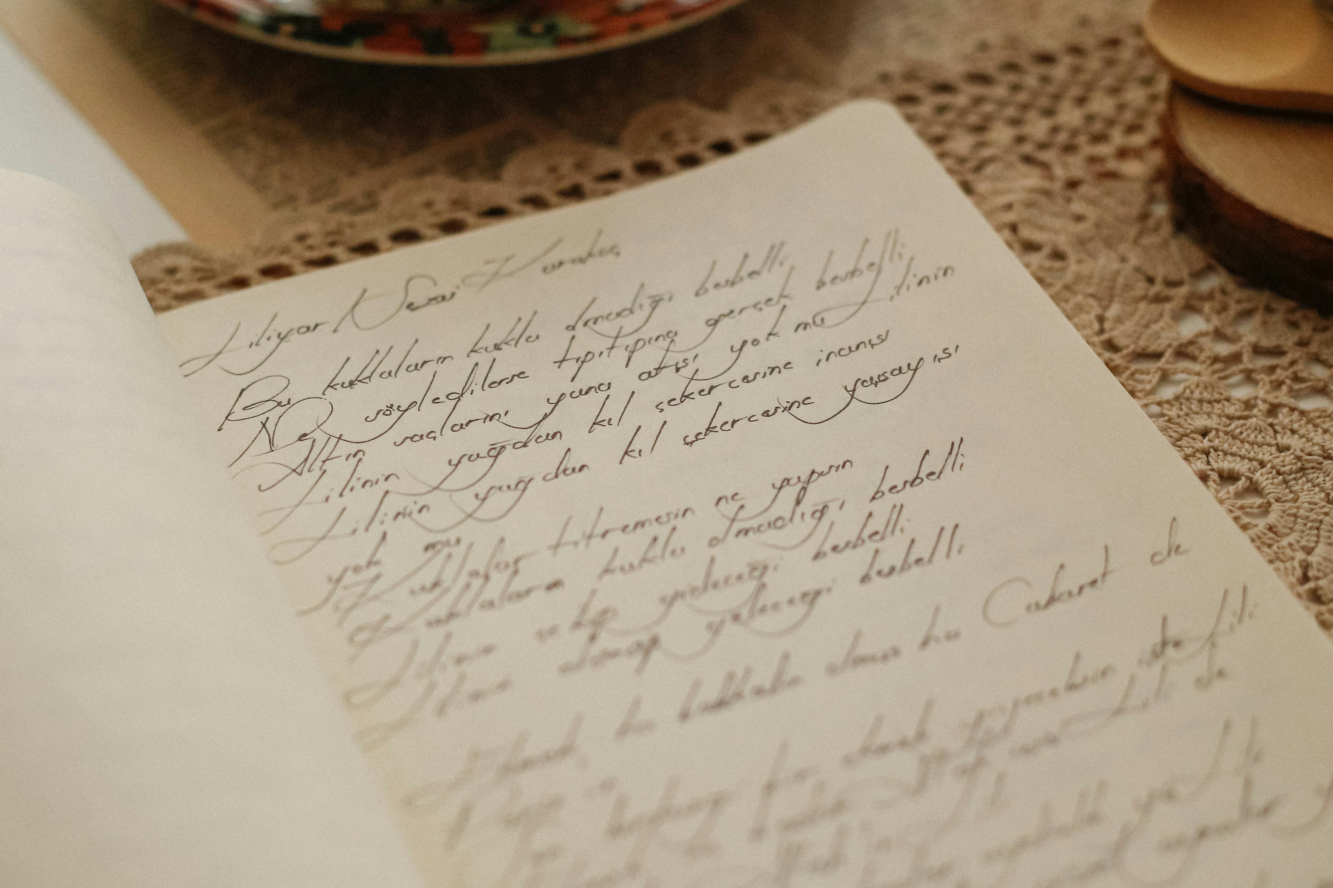 Elegant Handwritten Calligraphy on Vintage Paper · Free Stock Photo