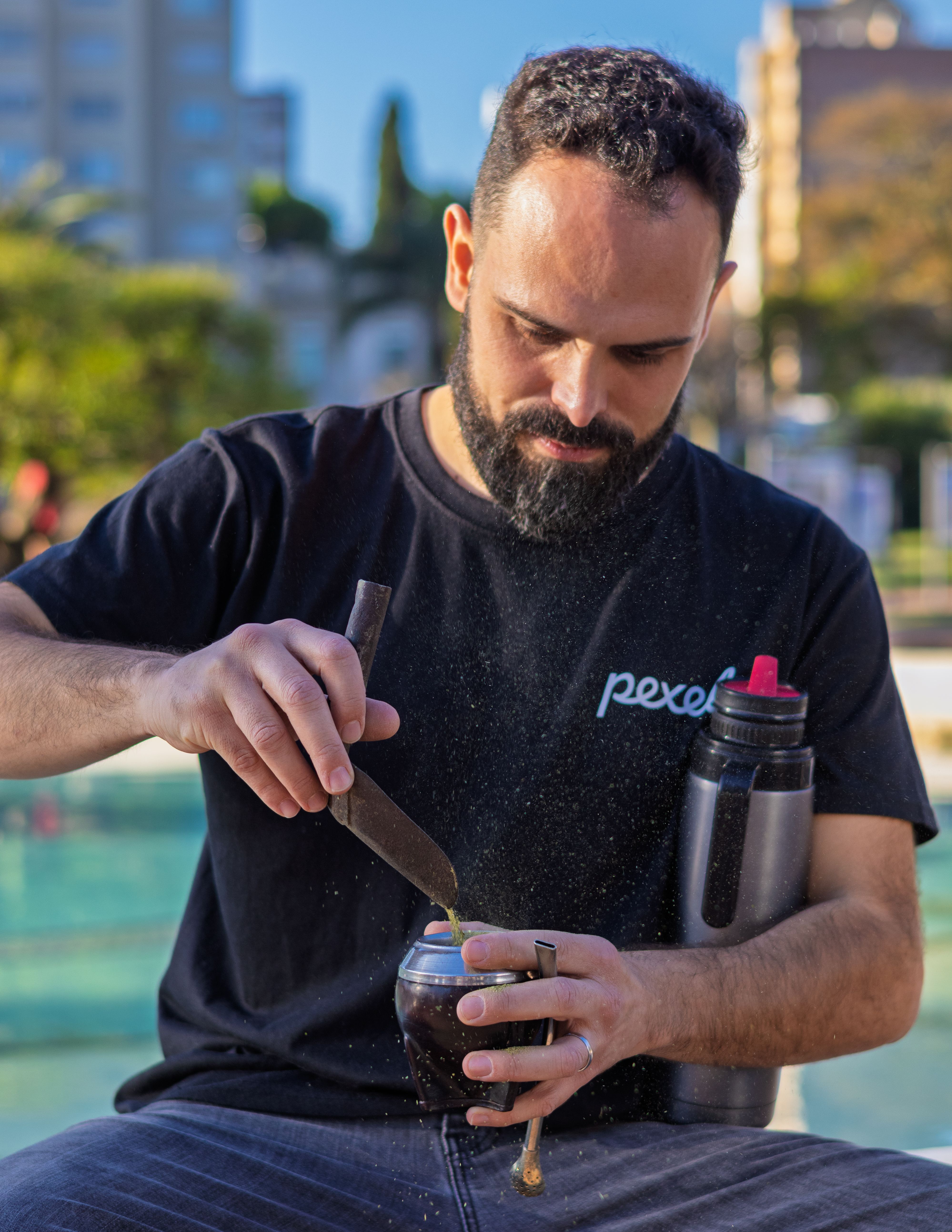 Preparing Traditional Maté in Outdoor Setting · Free Stock Photo