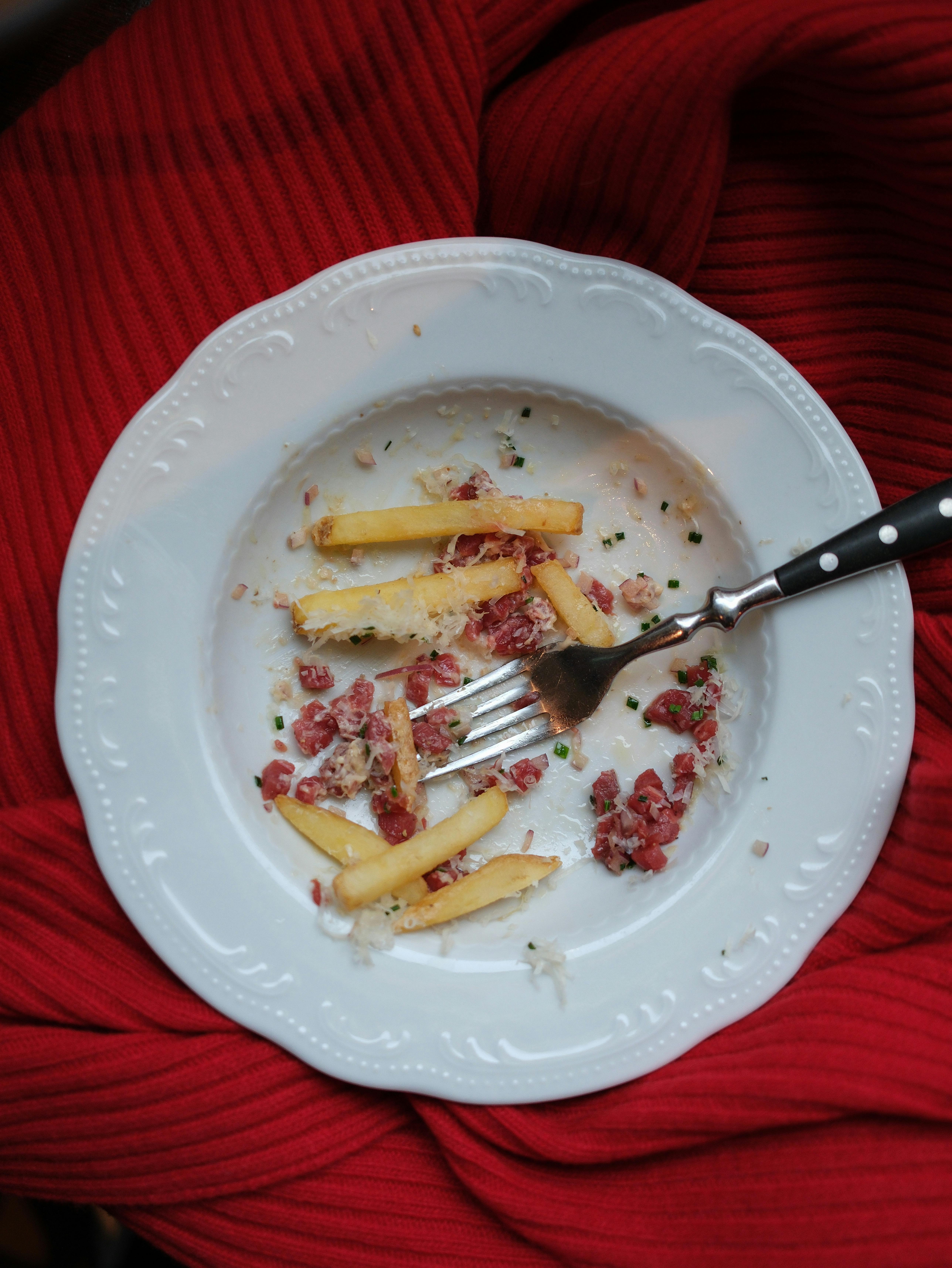 Leftover French Fries on Elegant Plate · Free Stock Photo