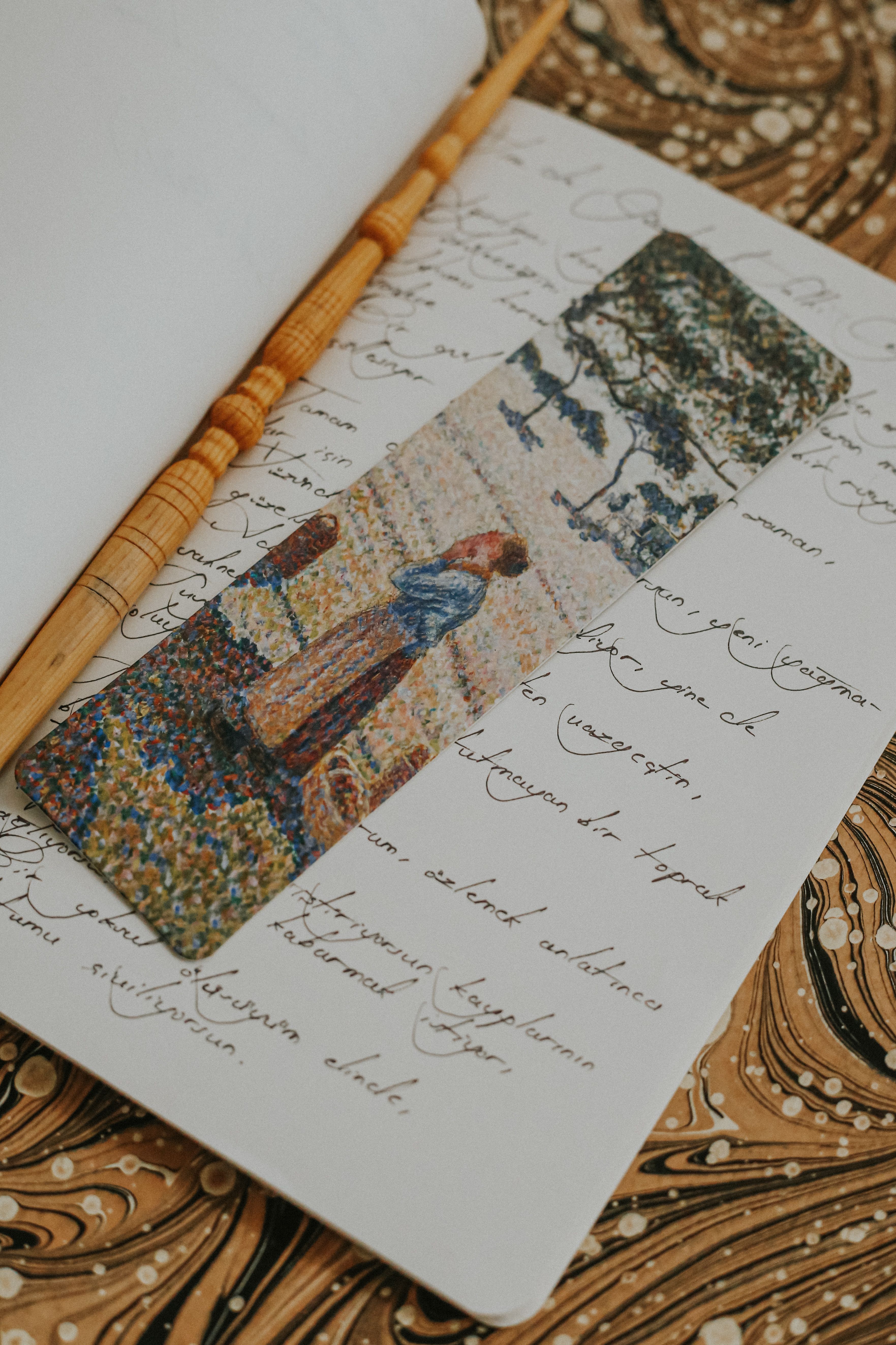 Artistic Bookmark on Calligraphy Notebook · Free Stock Photo