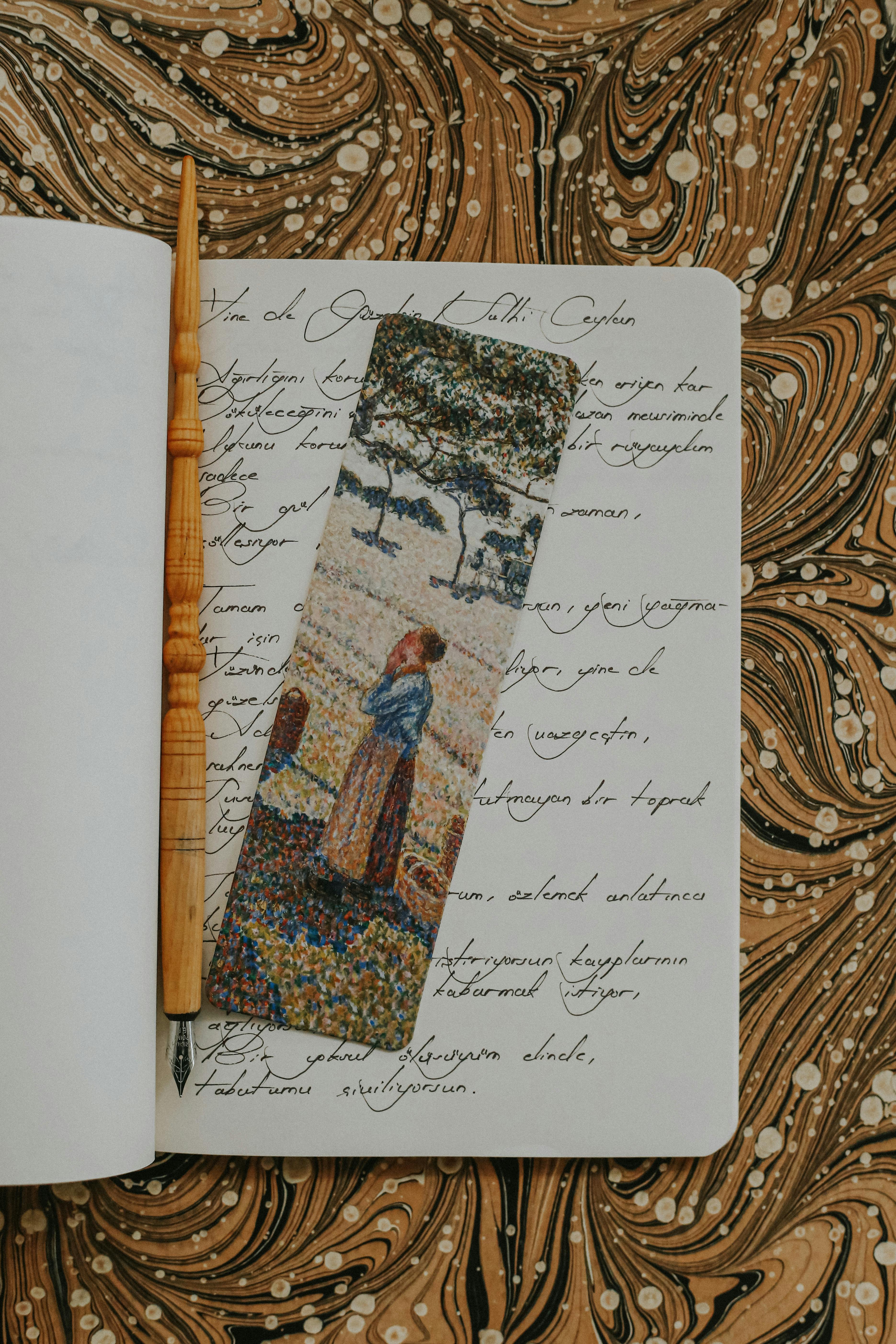 Vintage Bookmark and Calligraphy Pen on Journal · Free Stock Photo