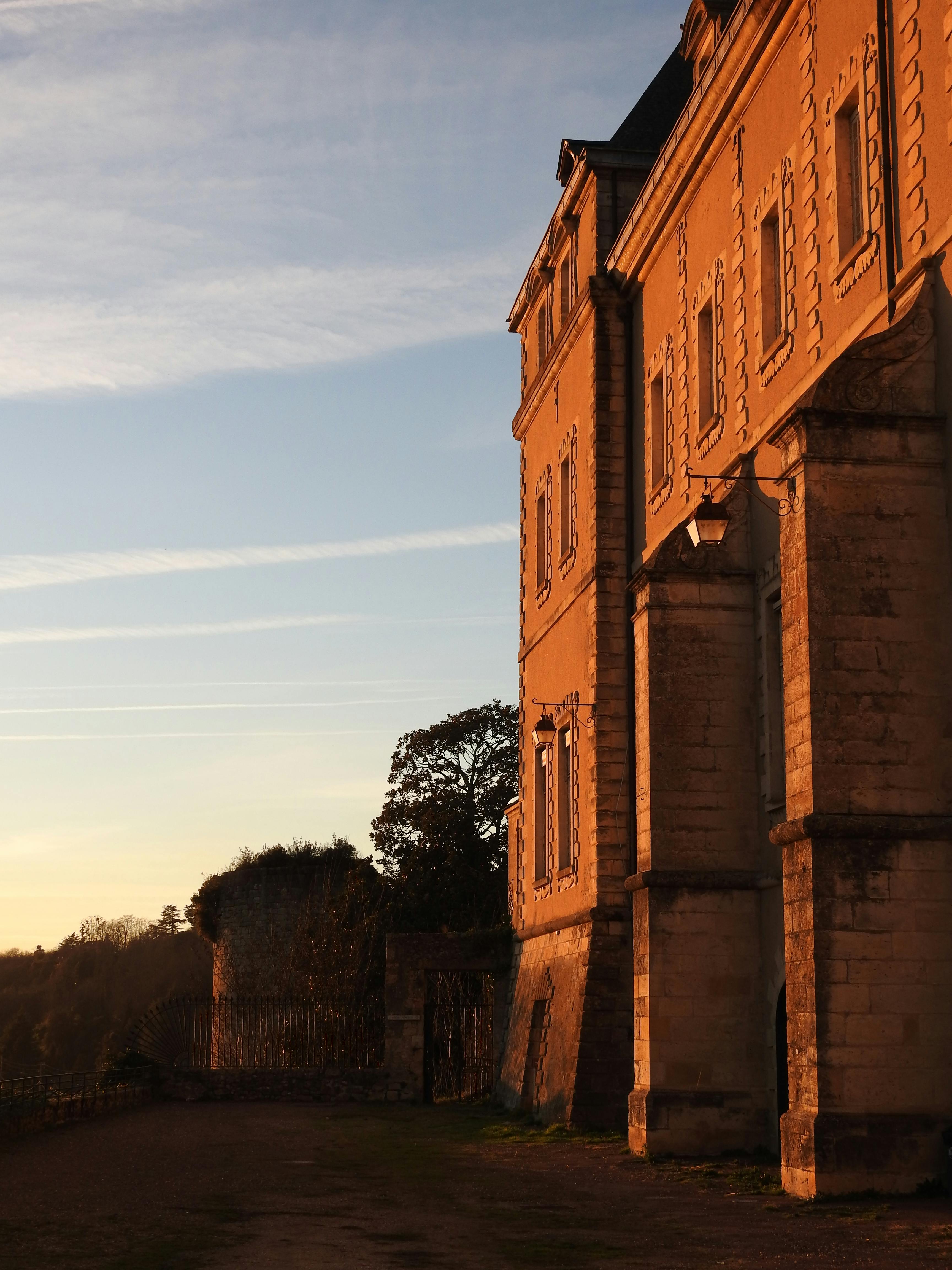 Historic Building at Golden Hour in La Réole · Free Stock Photo