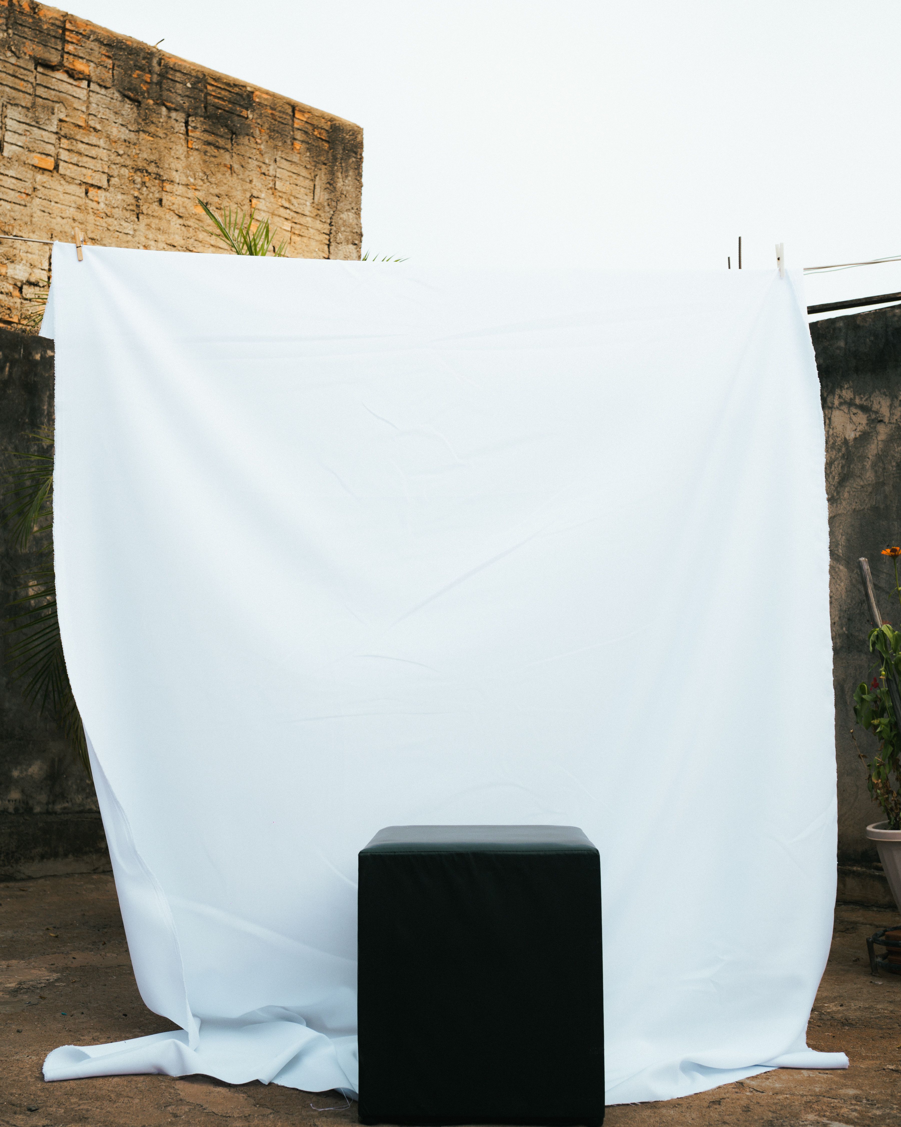 White Backdrop Set Up Outdoors in Urban Area · Free Stock Photo