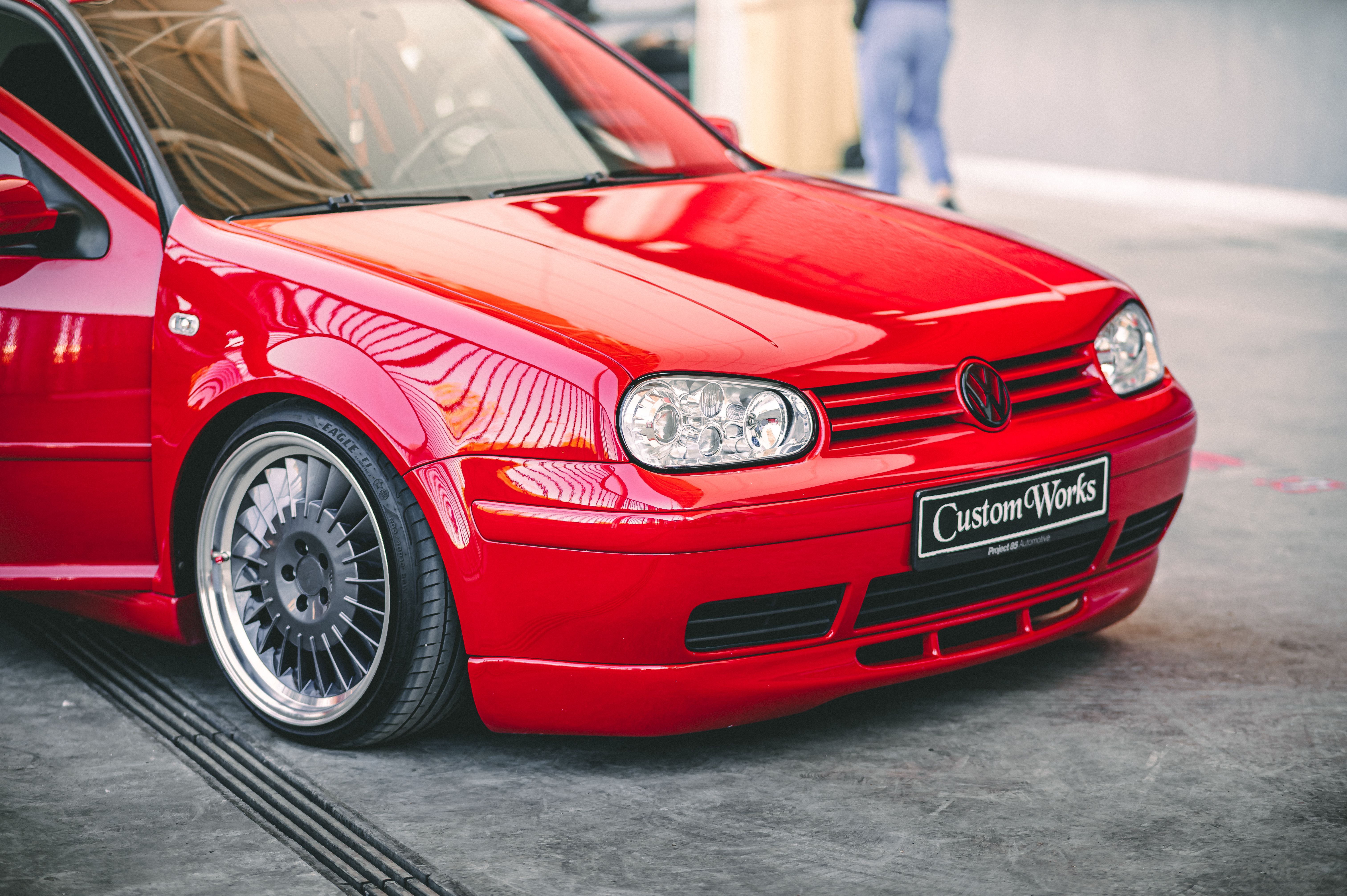 Red Custom Car in Indoor Garage Setting · Free Stock Photo