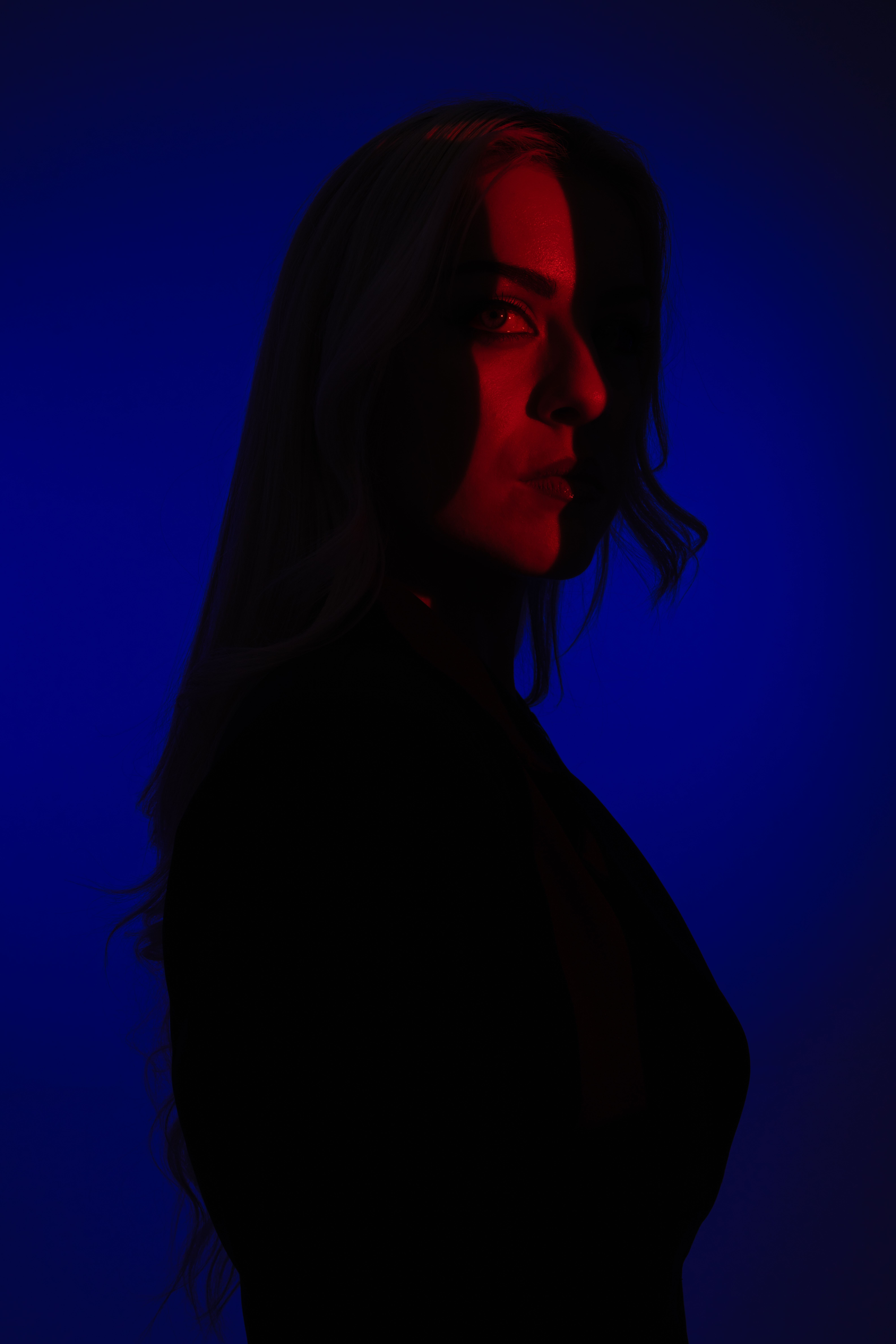 Dramatic Cinematic Portrait in Blue and Red Lighting · Free Stock Photo
