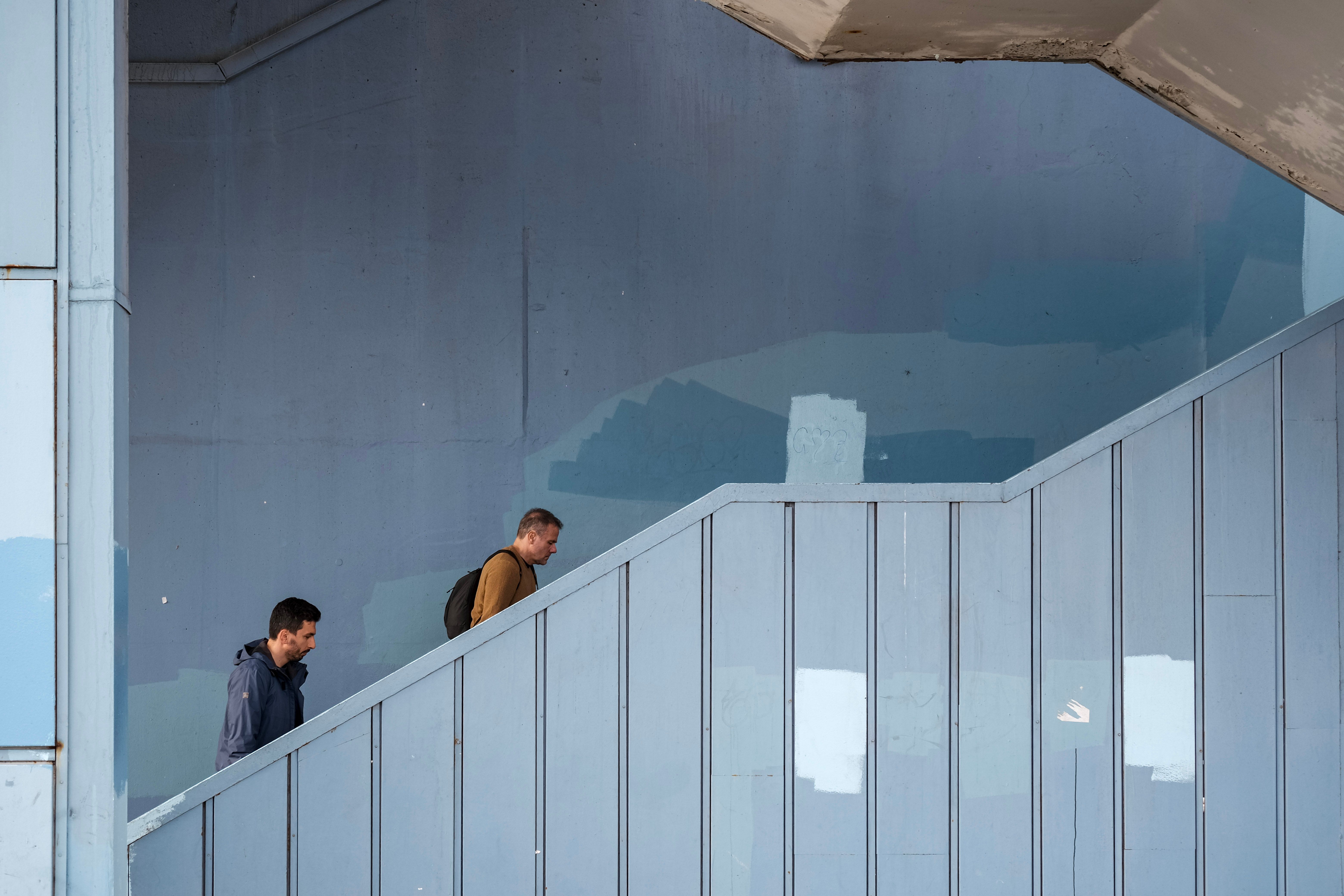 Men Ascending Stairway in Urban Istanbul Setting · Free Stock Photo