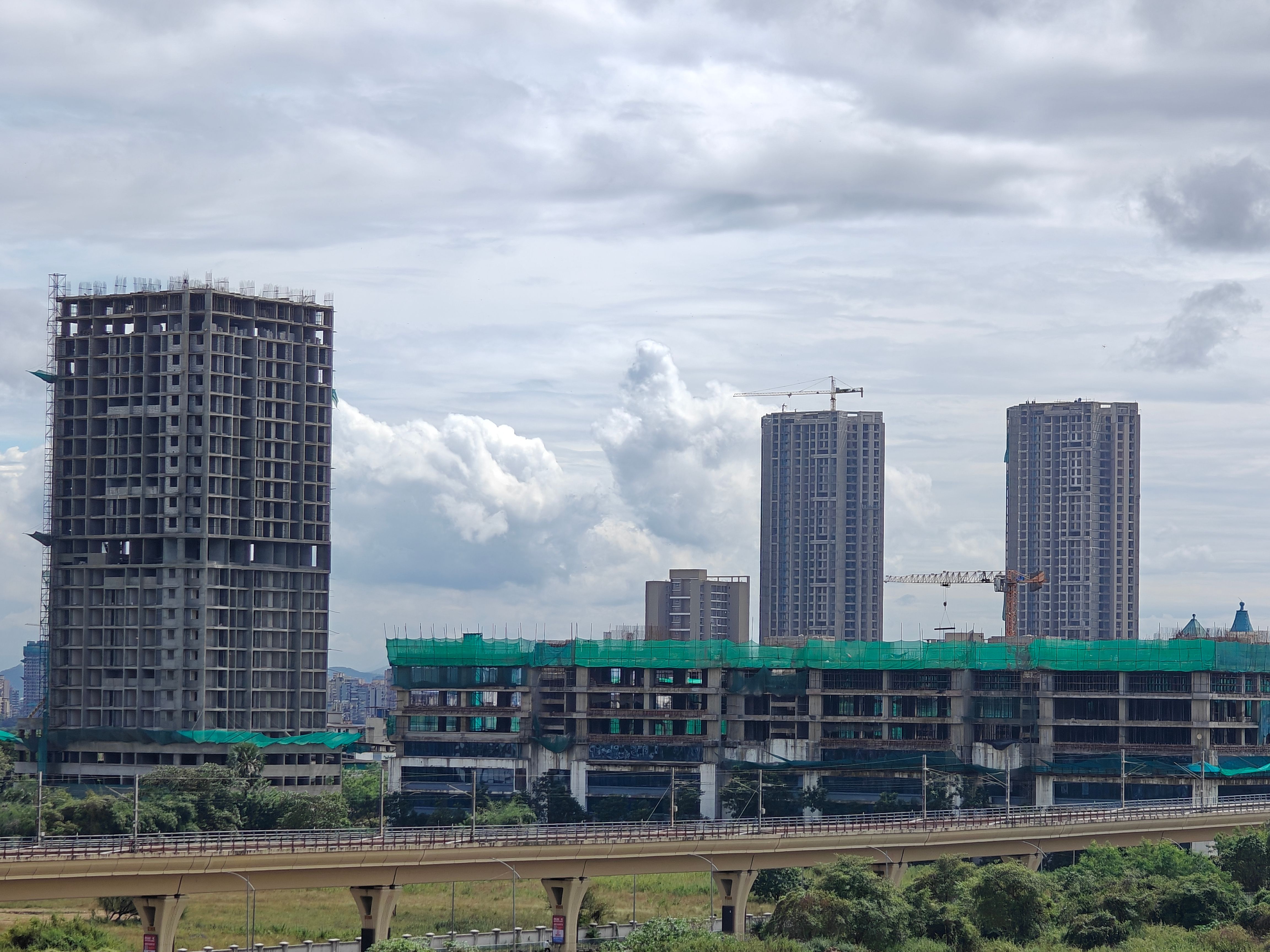 Urban Skyline with Construction and Tall Buildings · Free Stock Photo