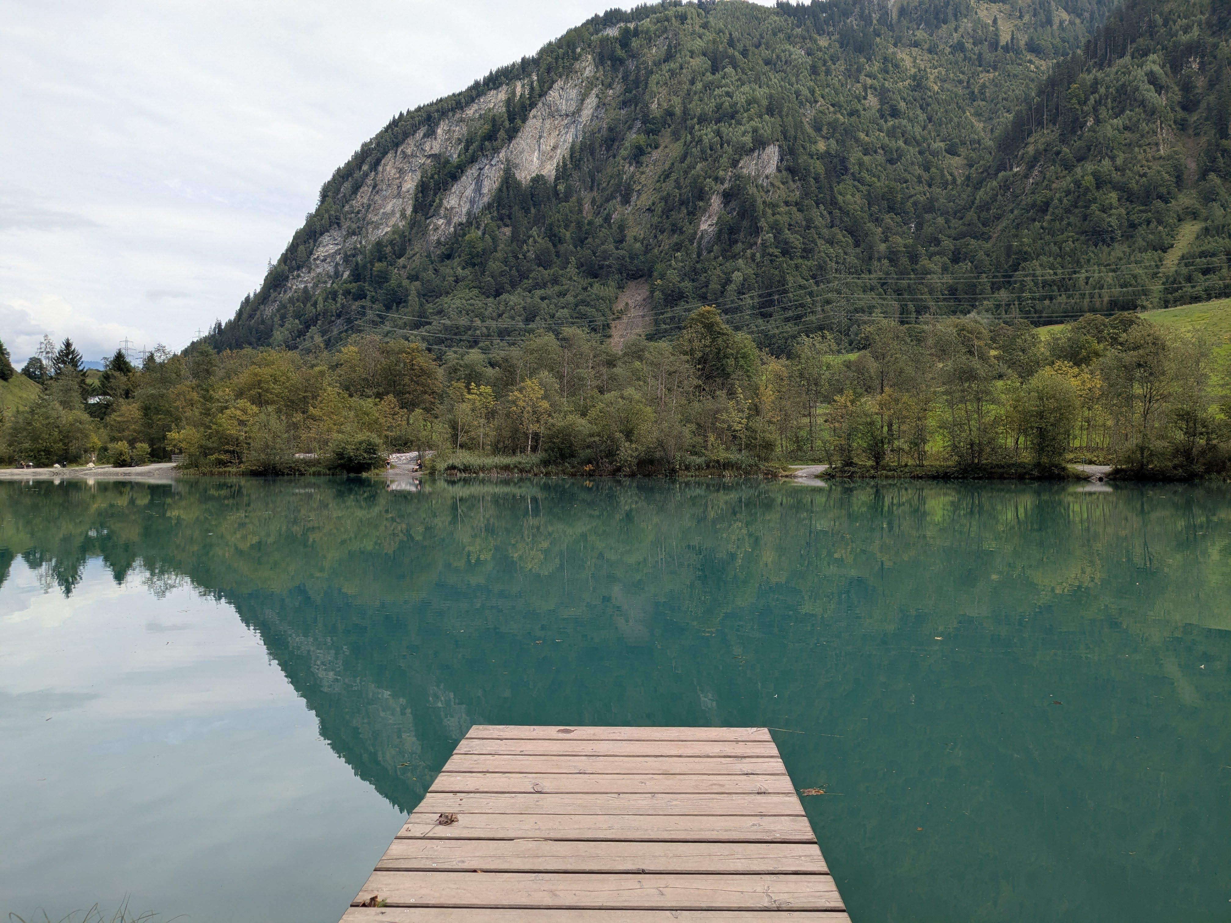 Serene Mountain Lake with Wooden Dock · Free Stock Photo