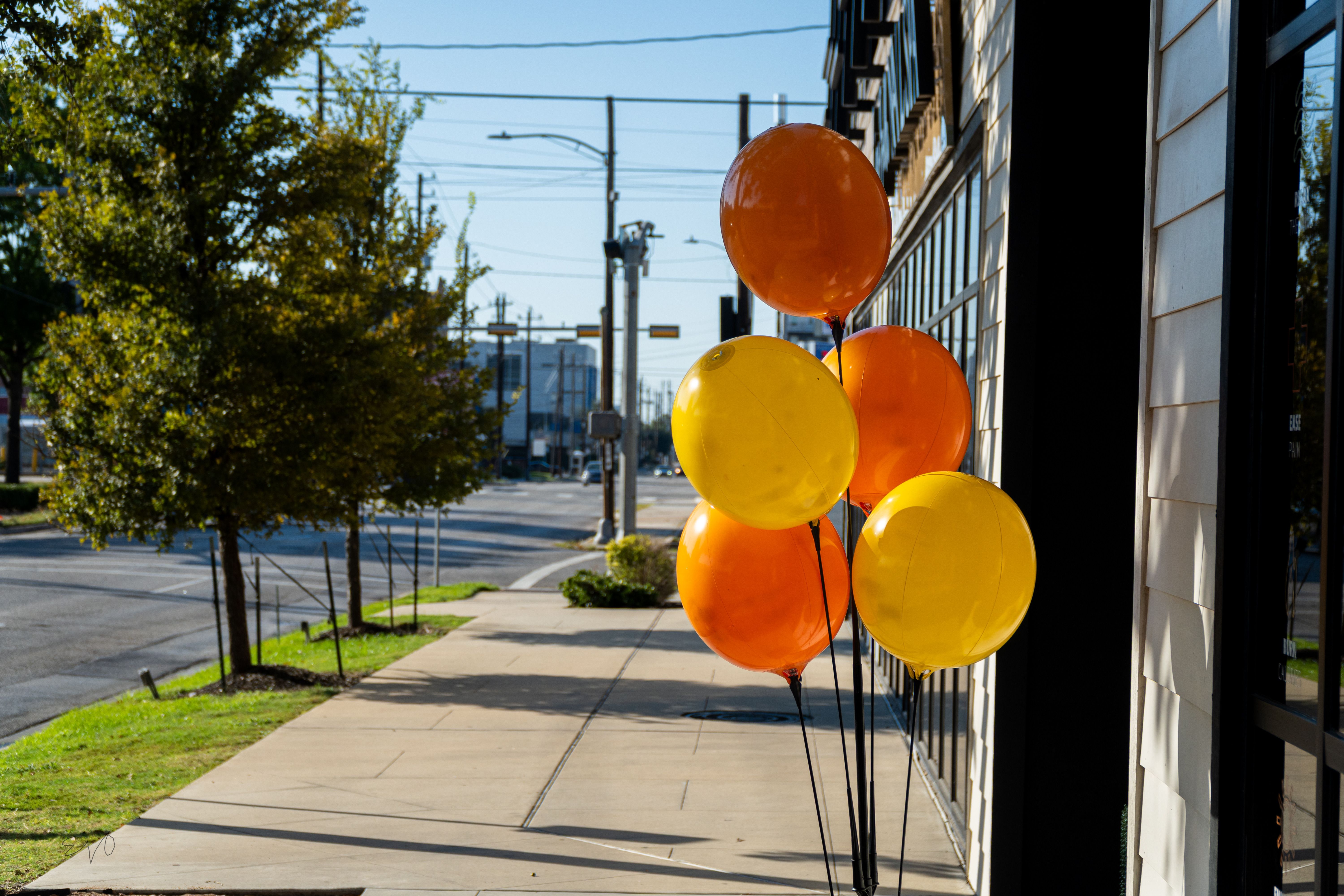 Vibrant Balloons on a Sunny Houston Street · Free Stock Photo