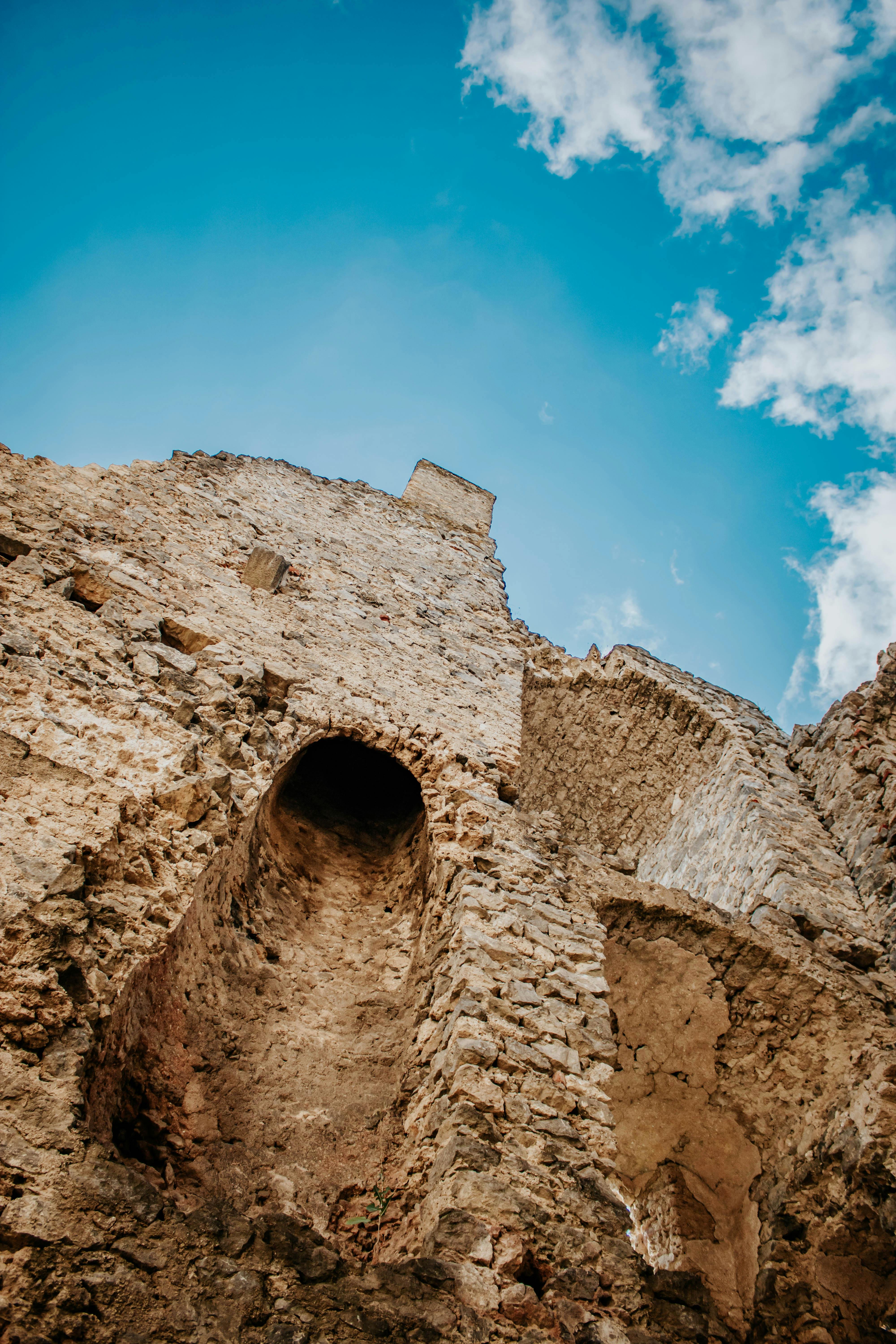Rustic Stone Castle Walls Under Blue Sky · Free Stock Photo