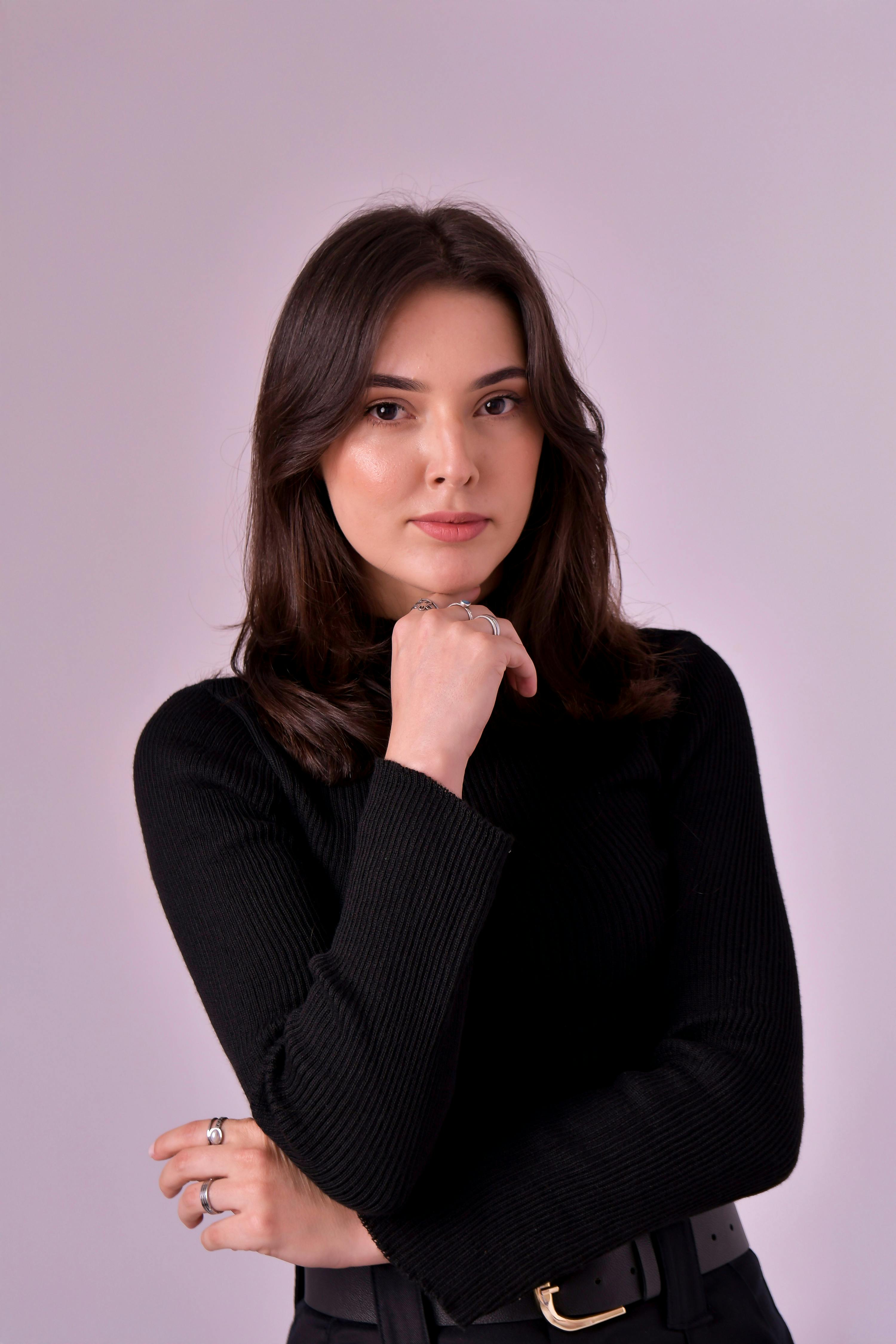Elegant Portrait of a Young Woman in Black · Free Stock Photo