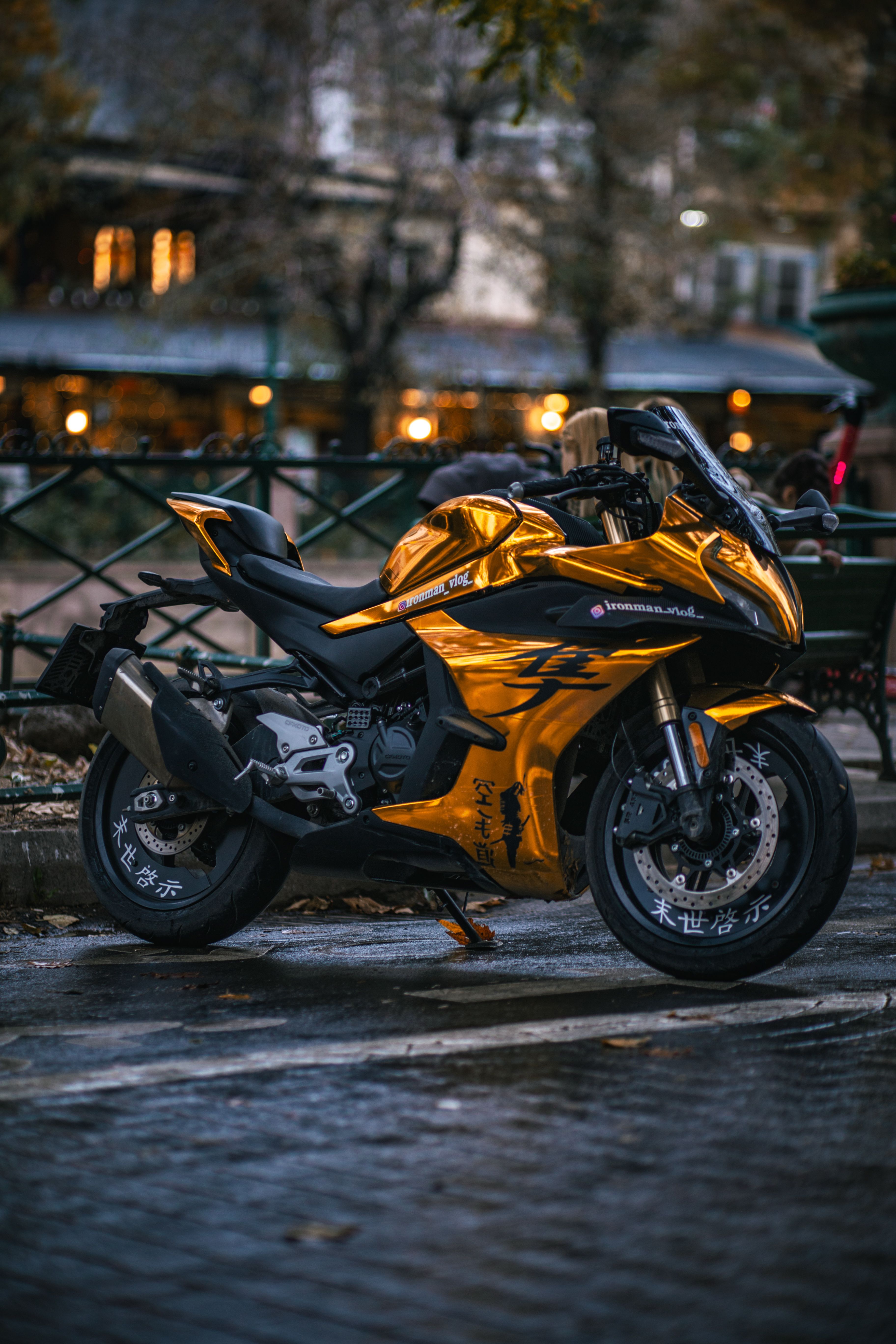 Golden Sport Motorcycle Parked in Urban Setting · Free Stock Photo