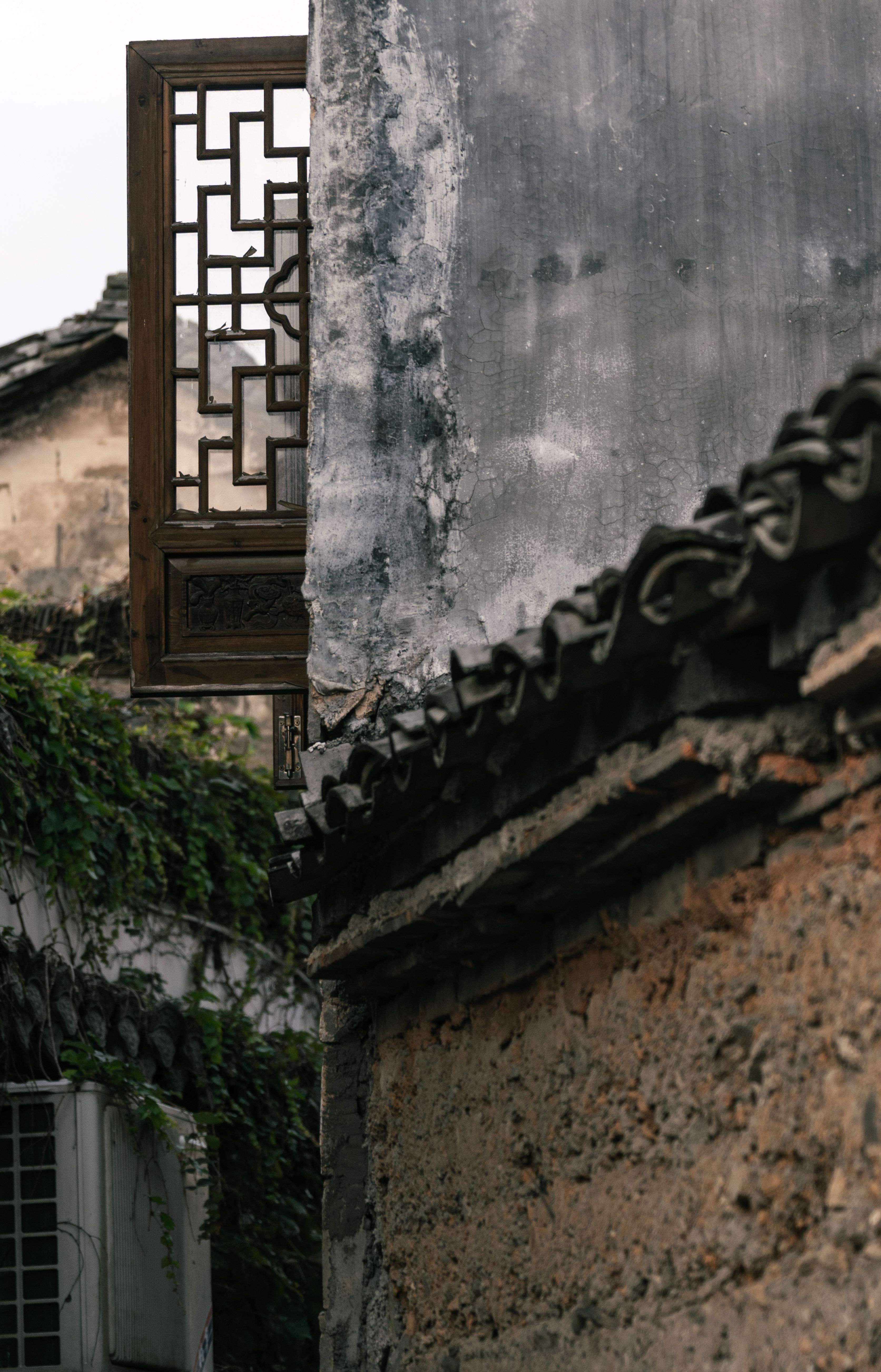 Rustic Asian Architecture with Ornate Wooden Window · Free Stock Photo