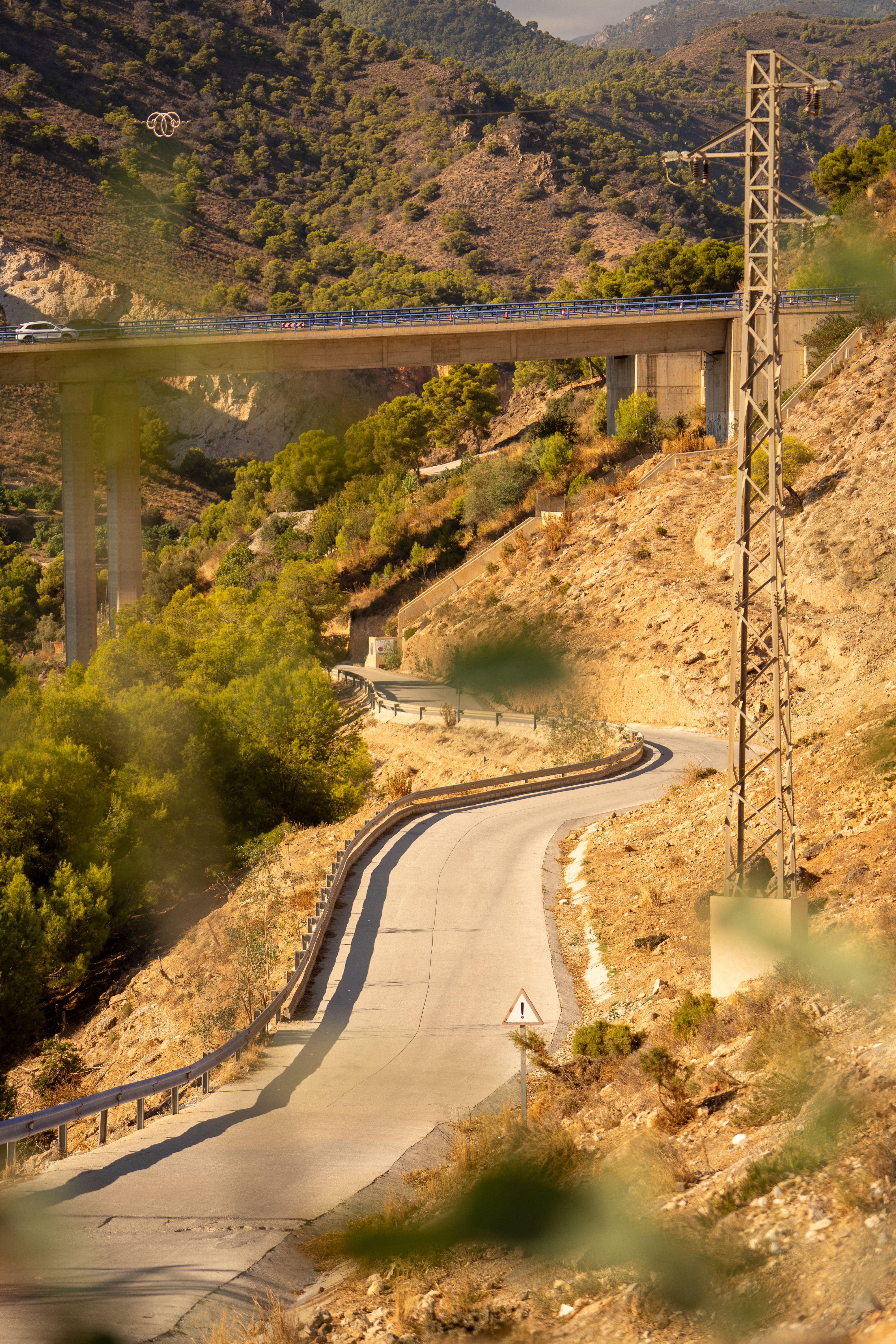 View of a Road on a Hill Leading to Apartment Buildings · Free Stock Photo