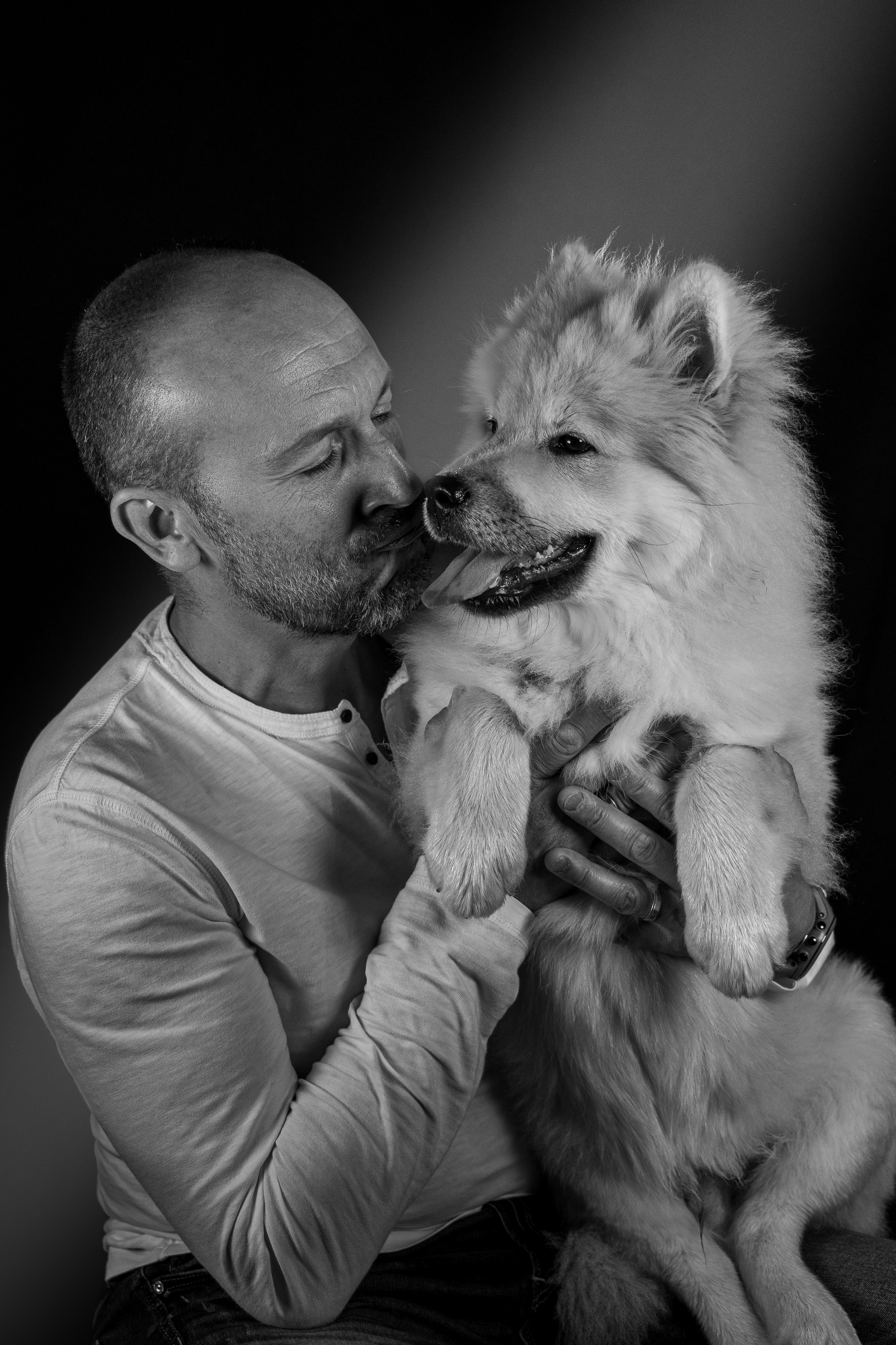 Loving Bond Between Man and Chow Chow in Studio · Free Stock Photo