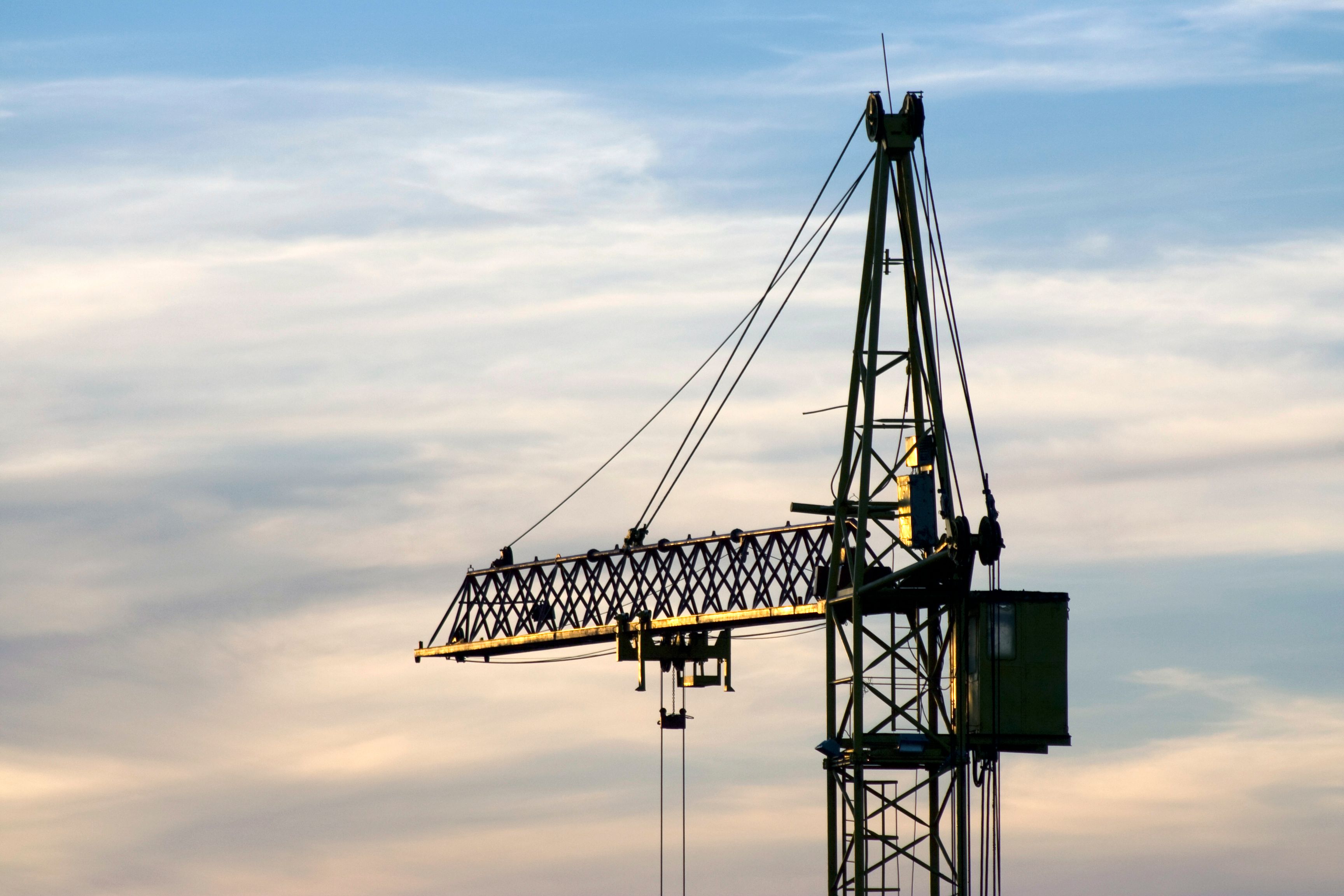 Tall Crane Against a Beautiful Sunset Sky · Free Stock Photo