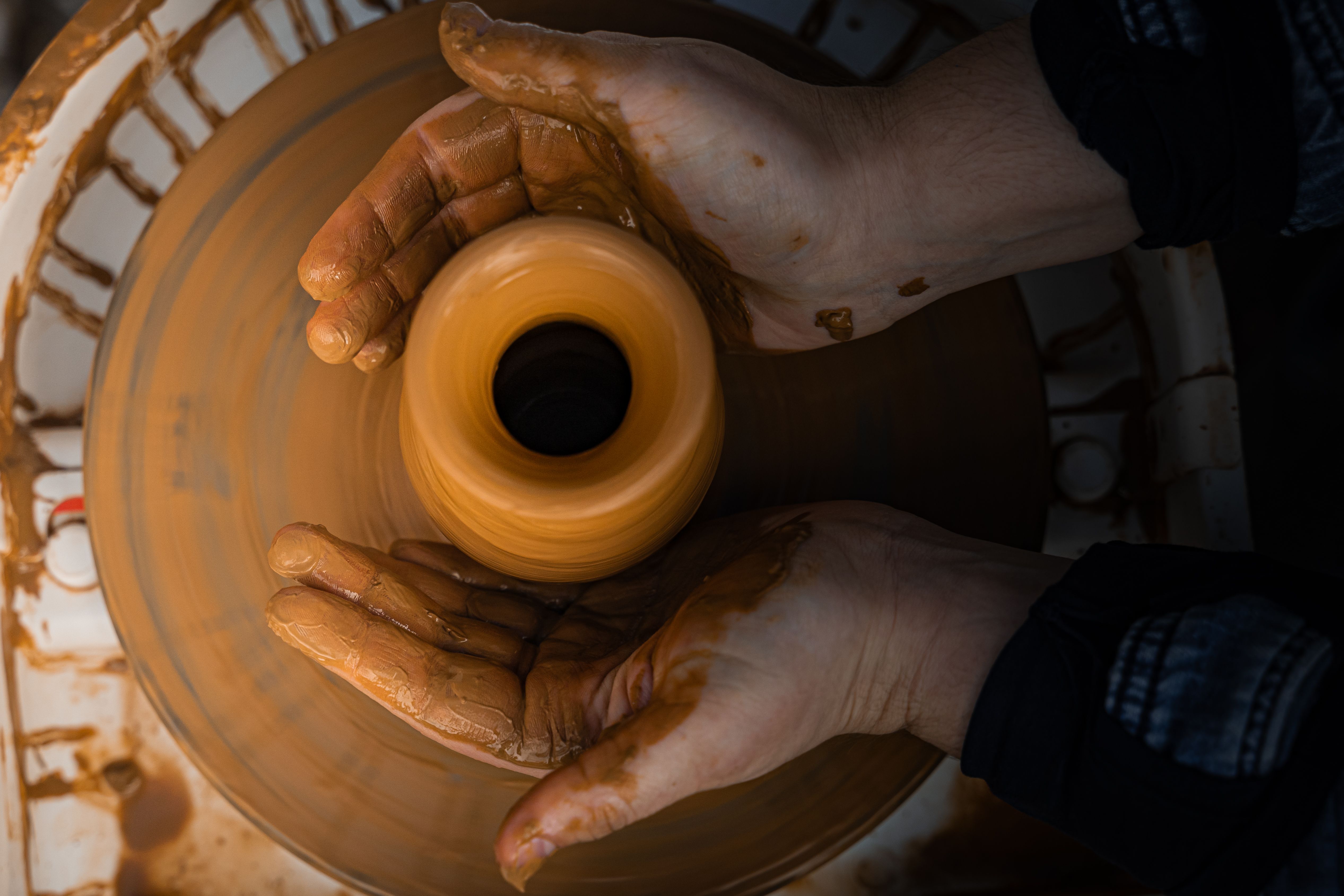 Close-Up of Pottery Crafting with Spinning Wheel · Free Stock Photo