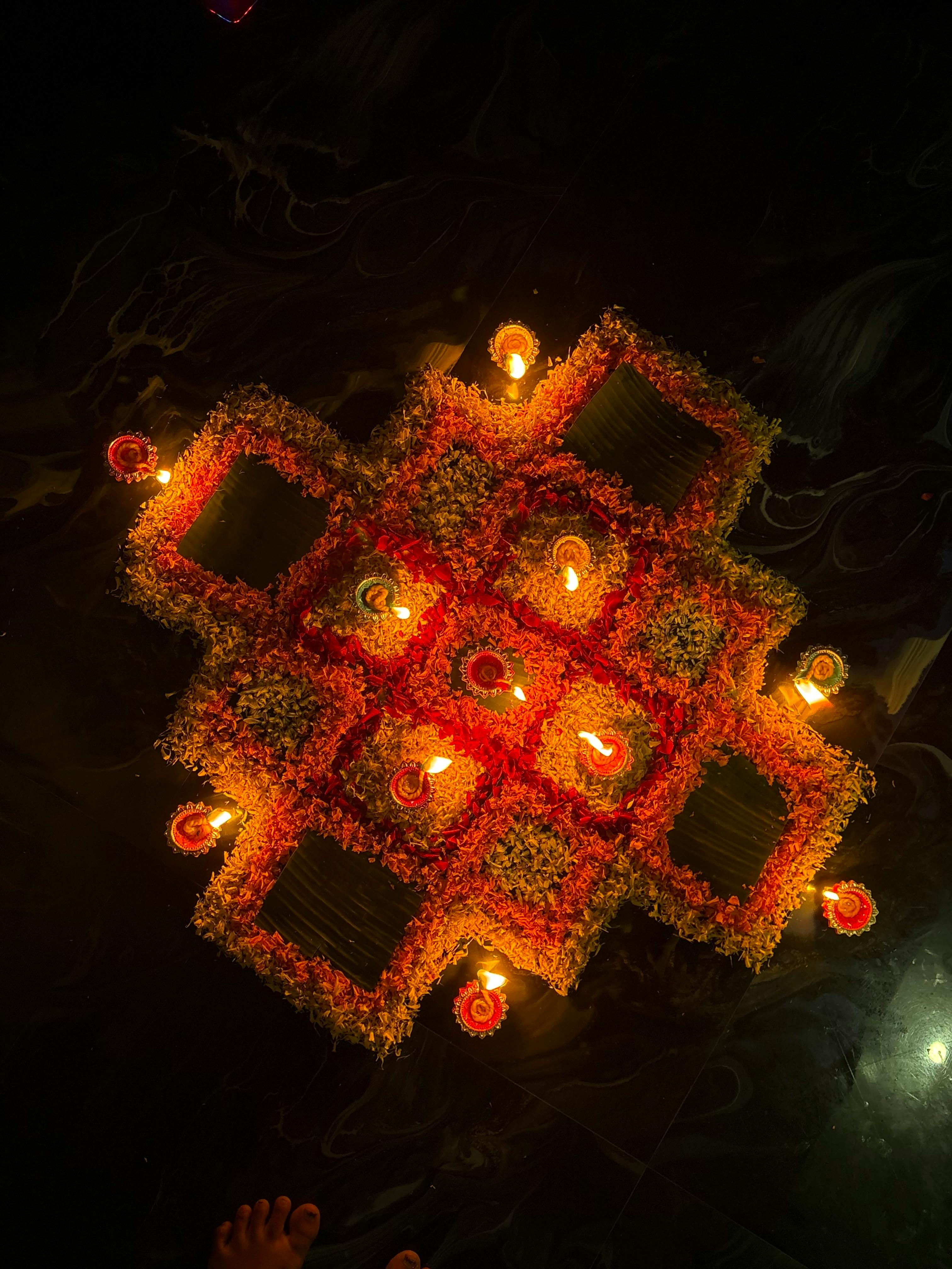 Colorful Rangoli with Diwali Diyas at Night · Free Stock Photo