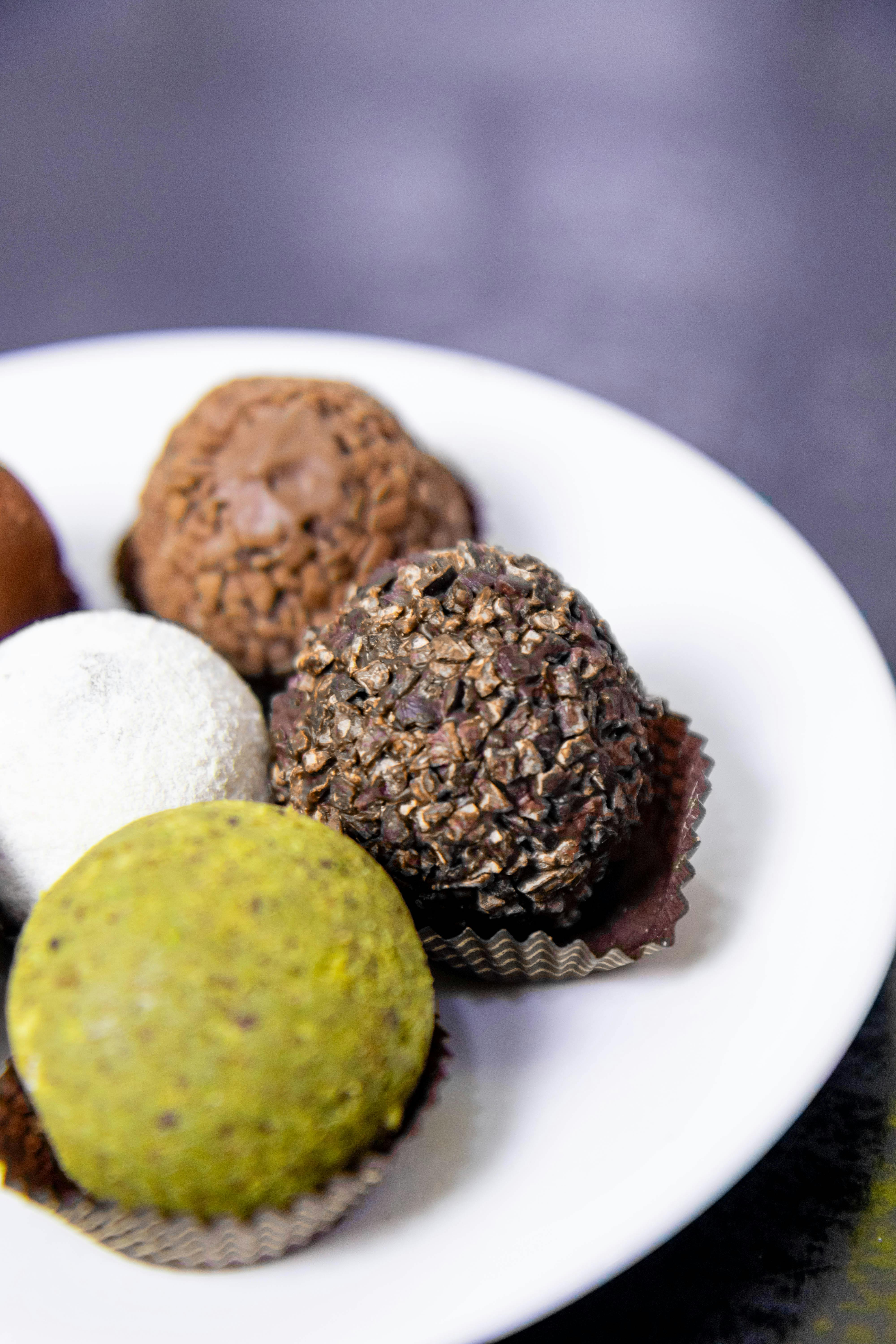 Assorted Gourmet Truffles on White Plate · Free Stock Photo