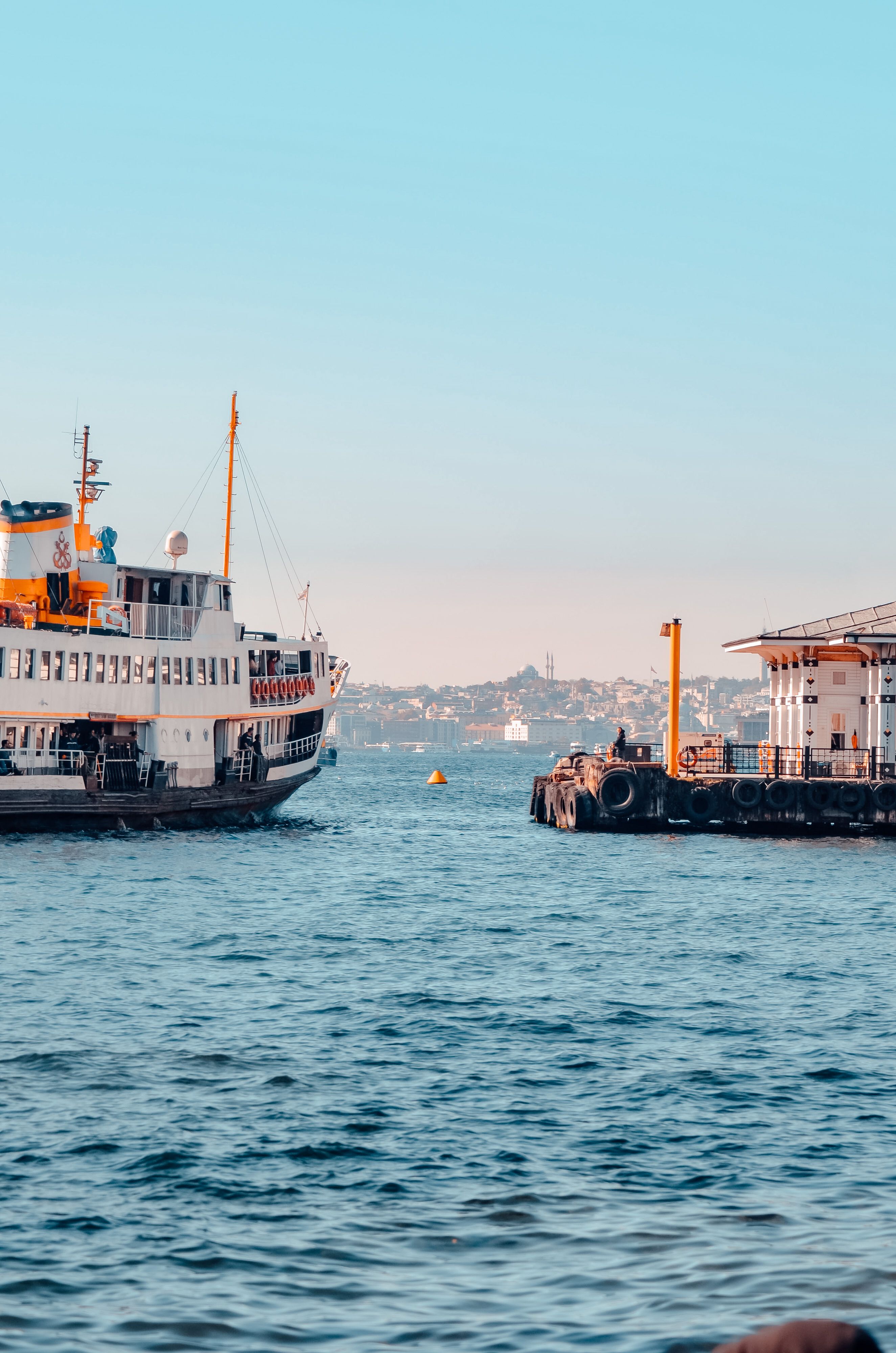 Iconic Ferry Departing Istanbul Dock at Sunset · Free Stock Photo