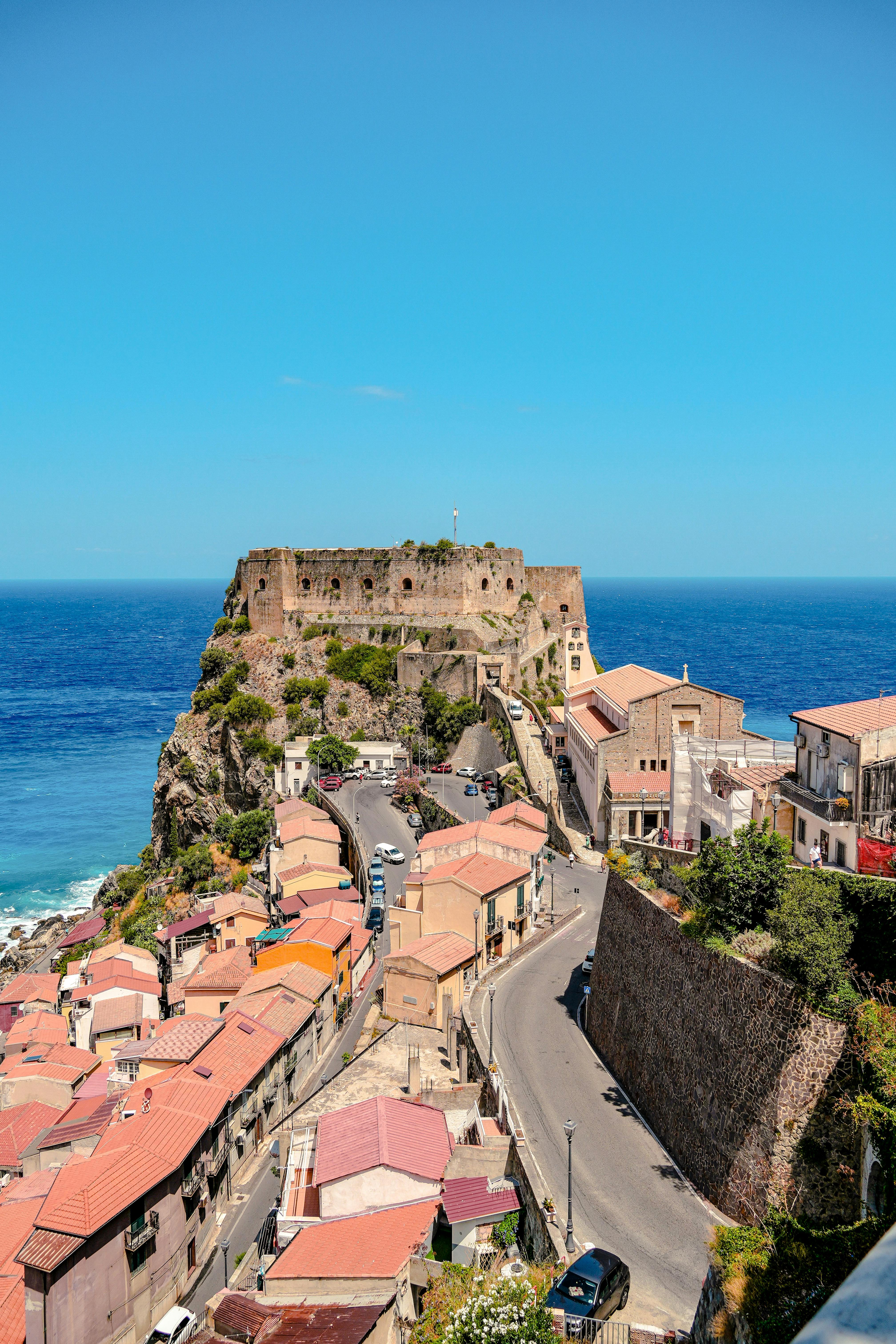 Stunning Cliffside Village and Ancient Fortress · Free Stock Photo