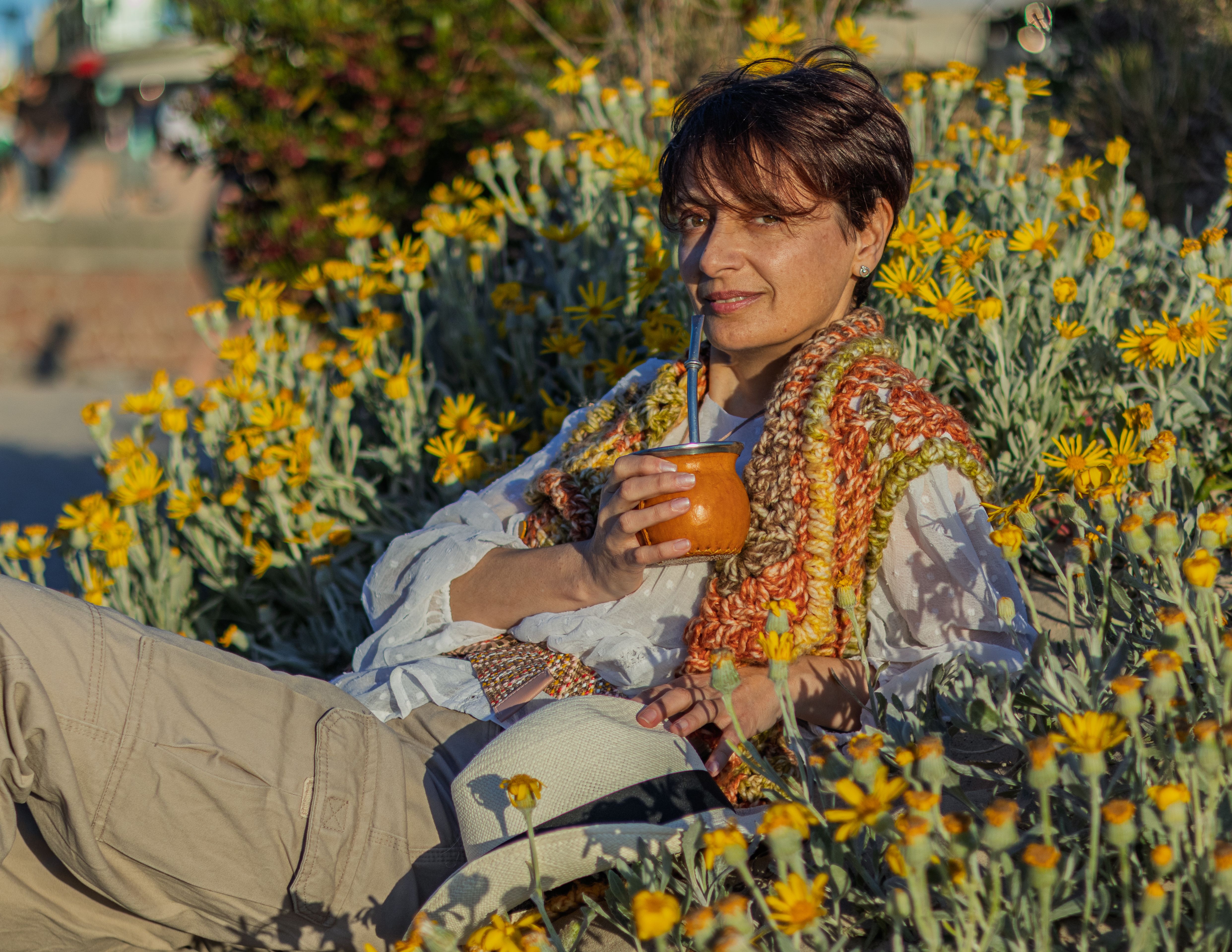Woman Enjoying Yerba Mate in Blooming Field · Free Stock Photo