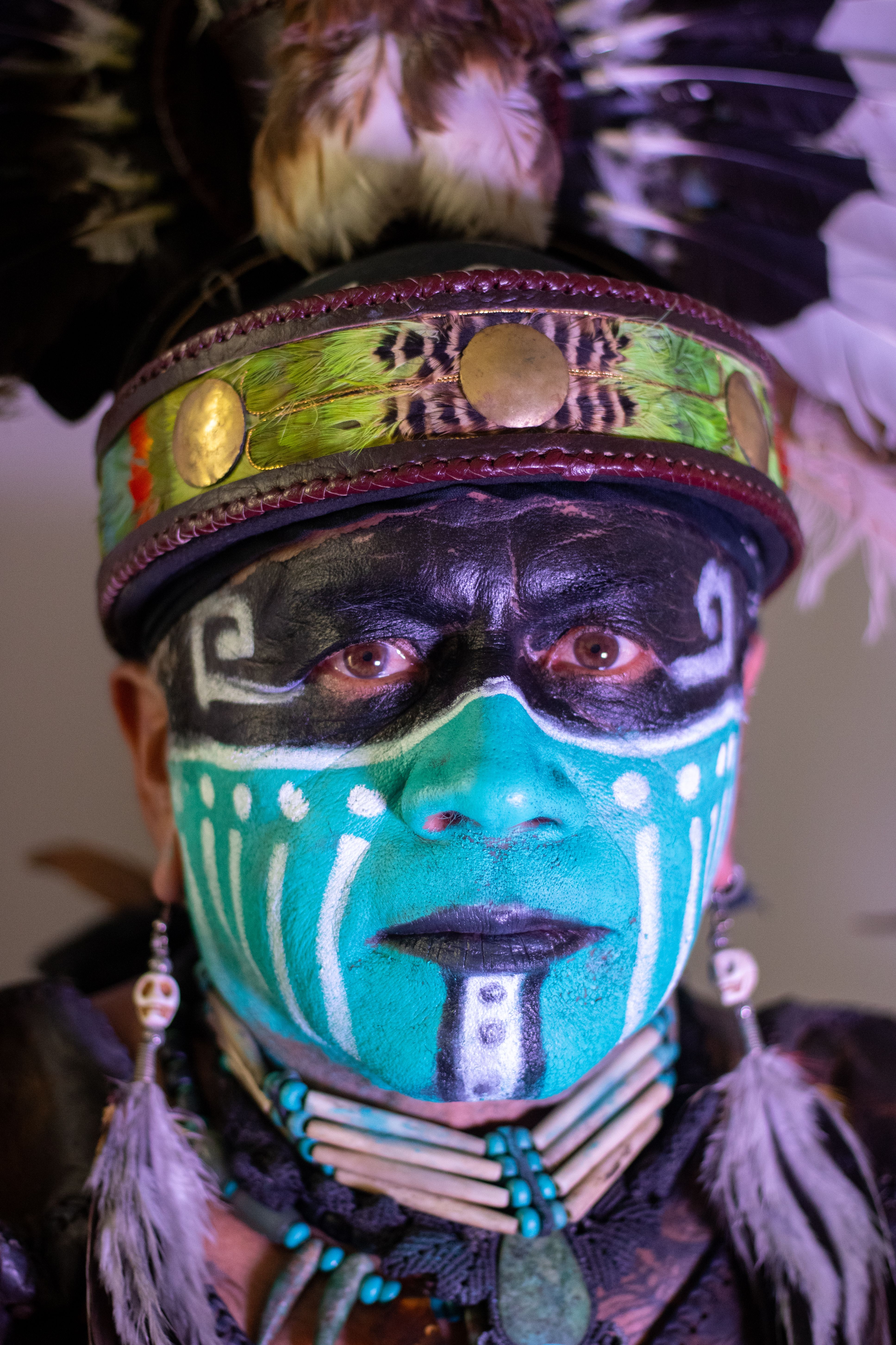 Vibrant Tribal Face Paint and Traditional Attire · Free Stock Photo