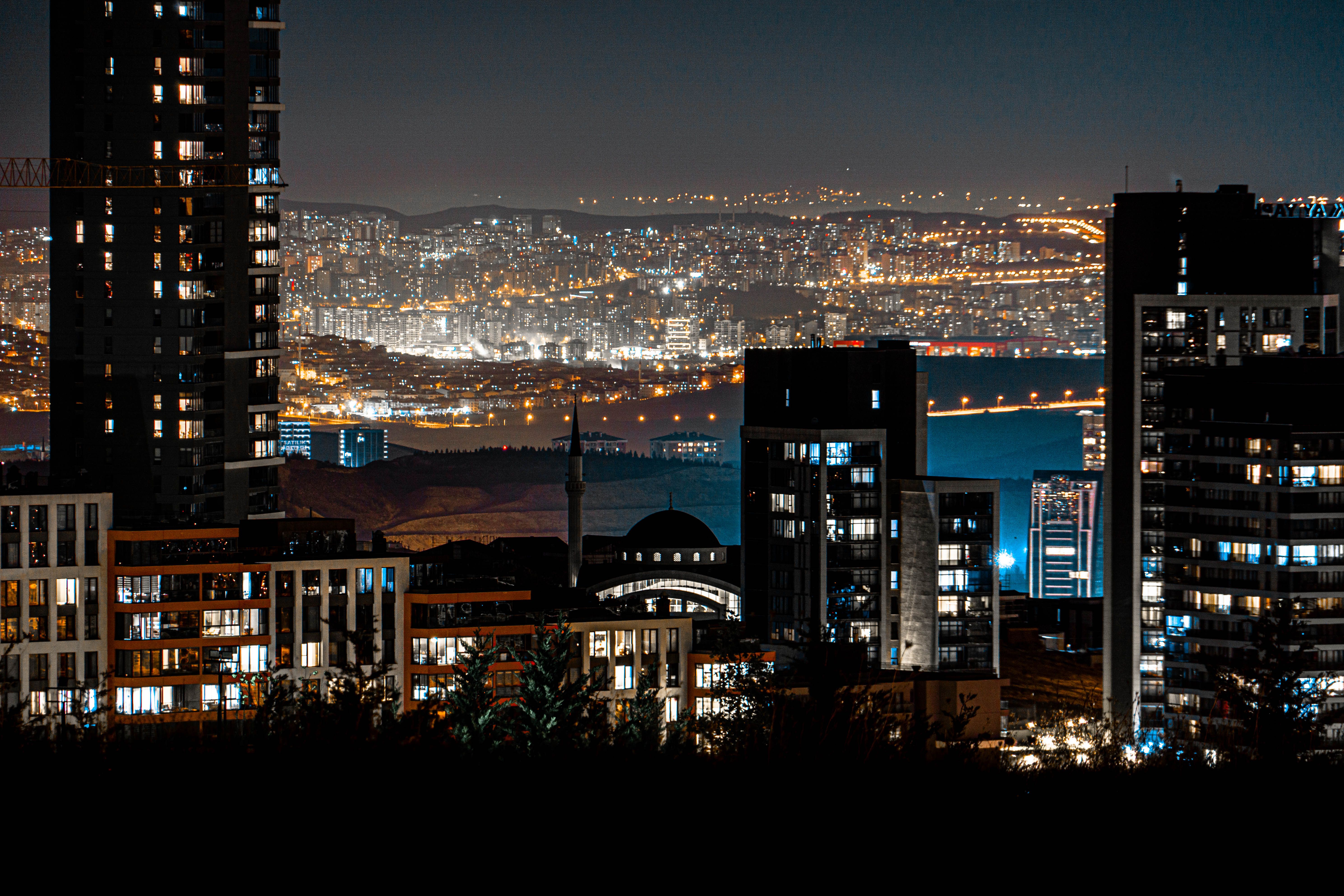Stunning Night Cityscape with Illuminated Skyscrapers · Free Stock Photo