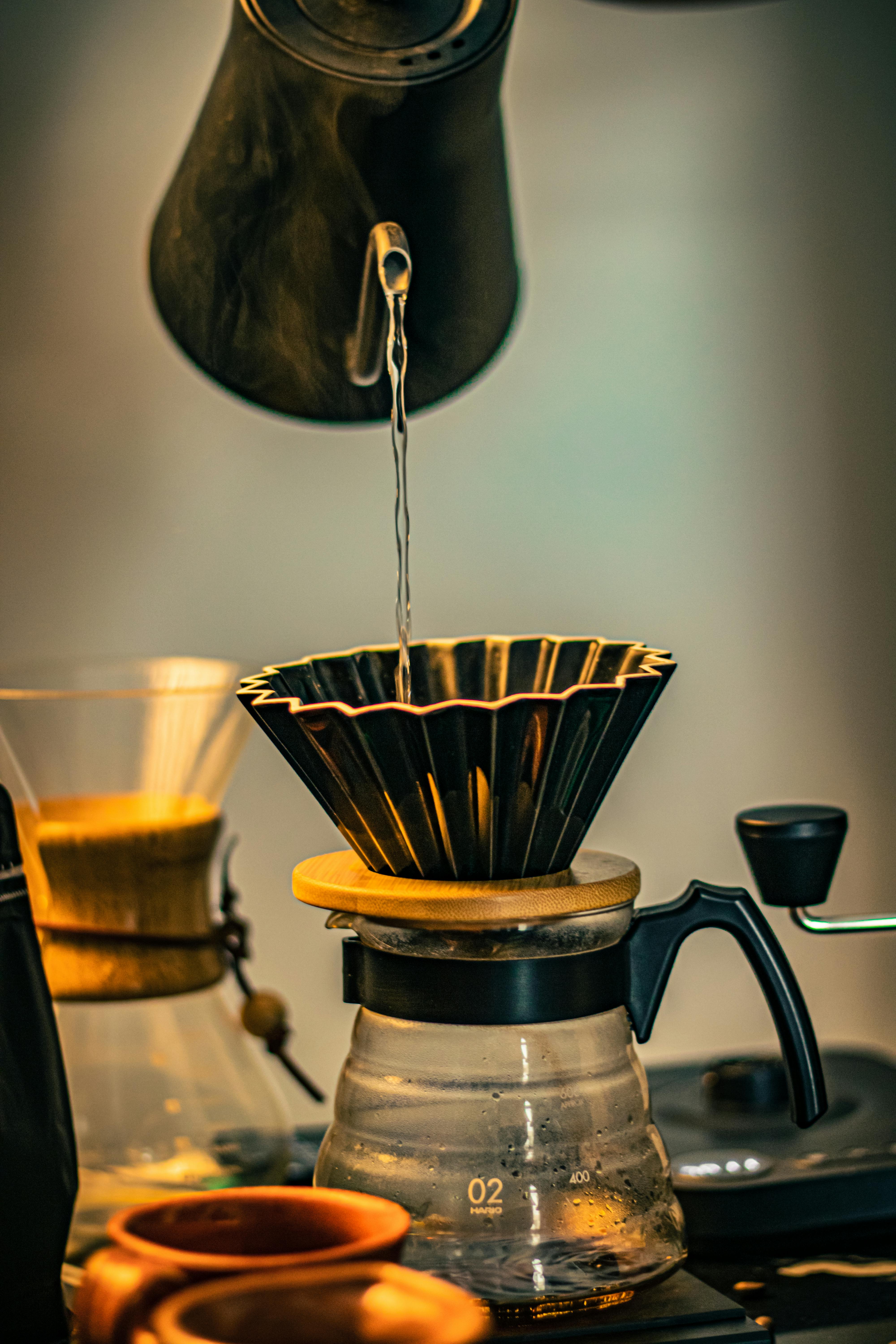 Gold Kettle Pouring Hot Water on Cup of Tea · Free Stock Photo