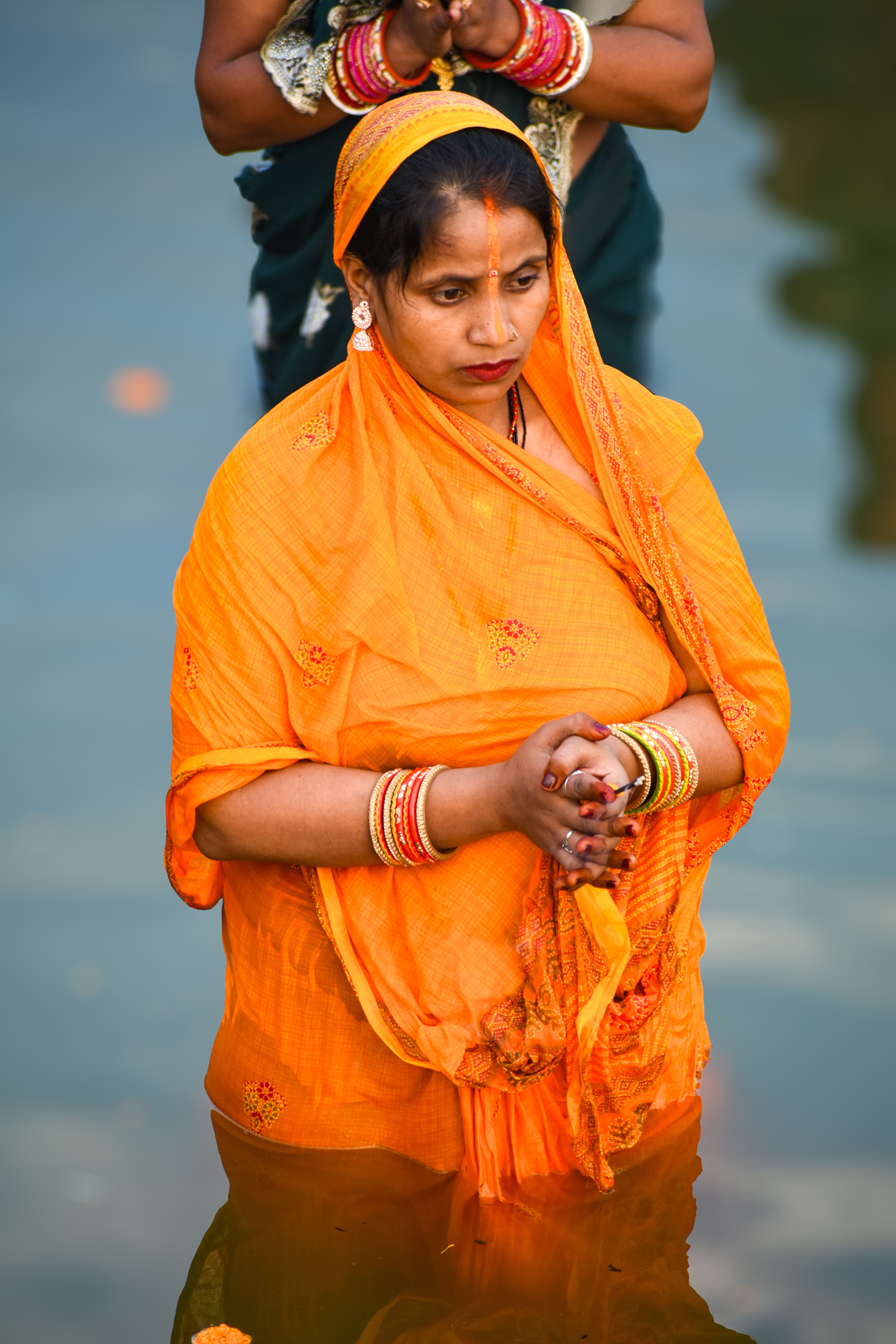Woman in Traditional Attire Performing Ritual · Free Stock Photo