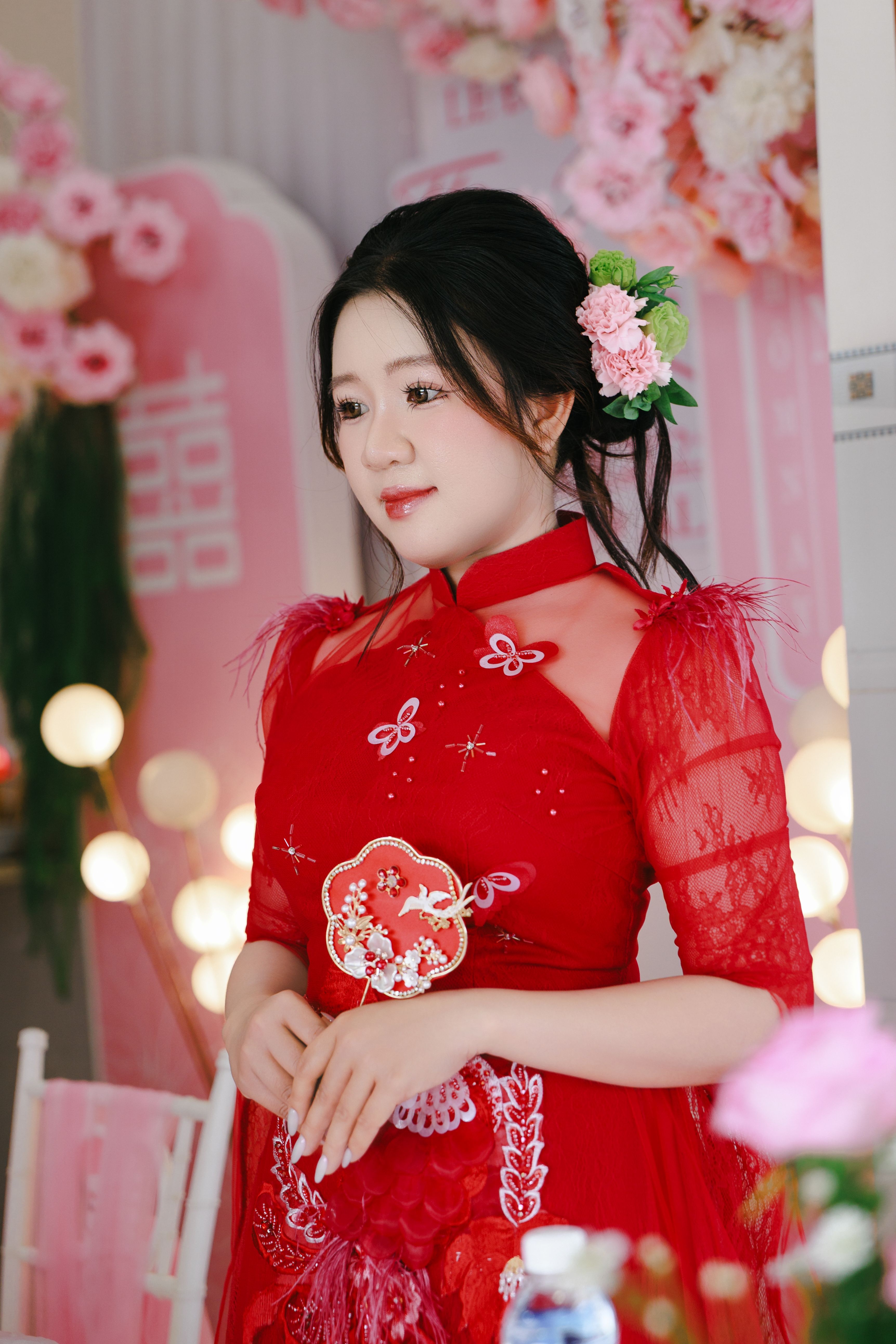 Elegant Woman in Traditional Red Dress with Floral Decor · Free Stock Photo