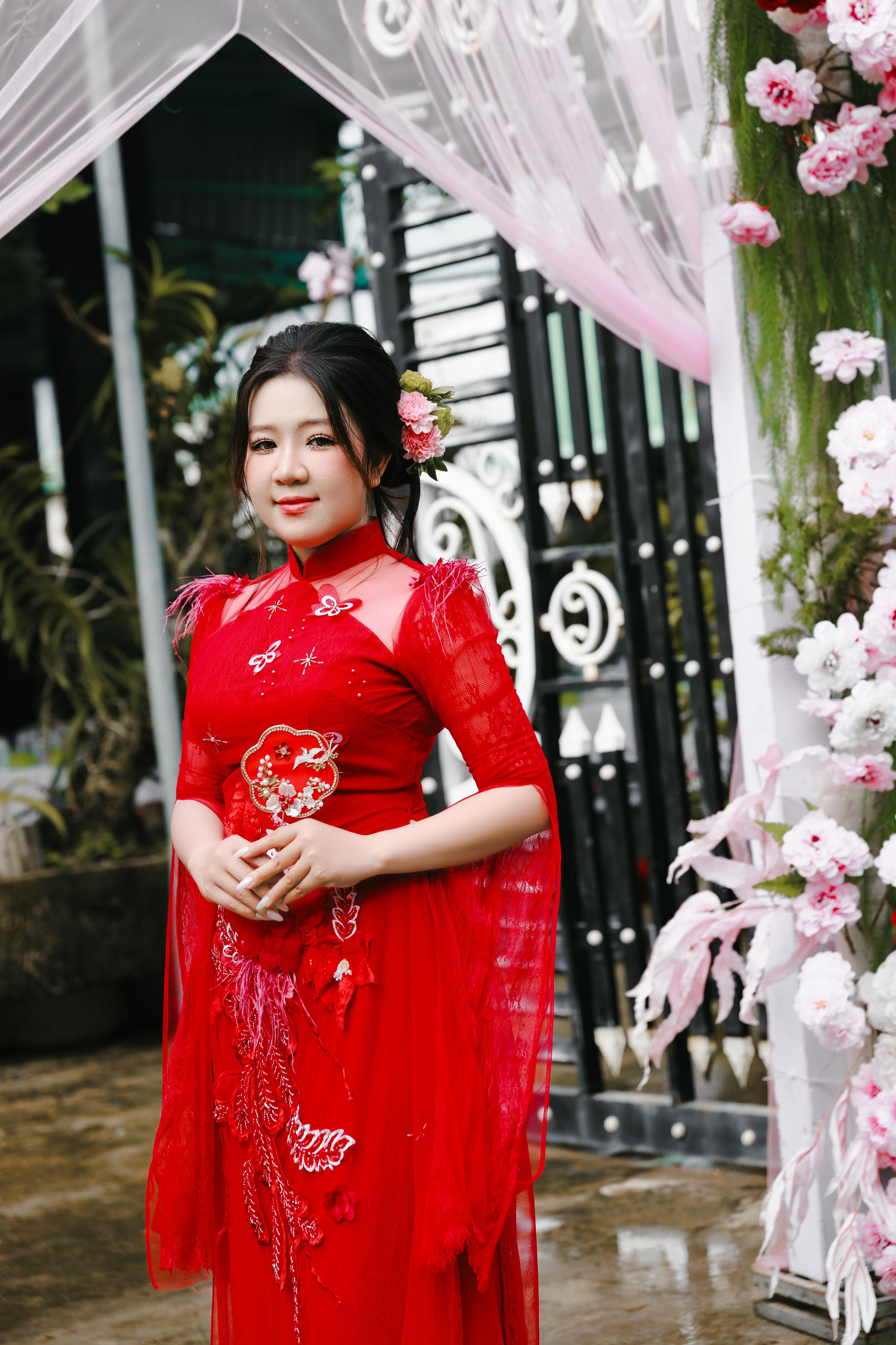Young Woman in Red Traditional Dress at Outdoor Ceremony · Free Stock Photo