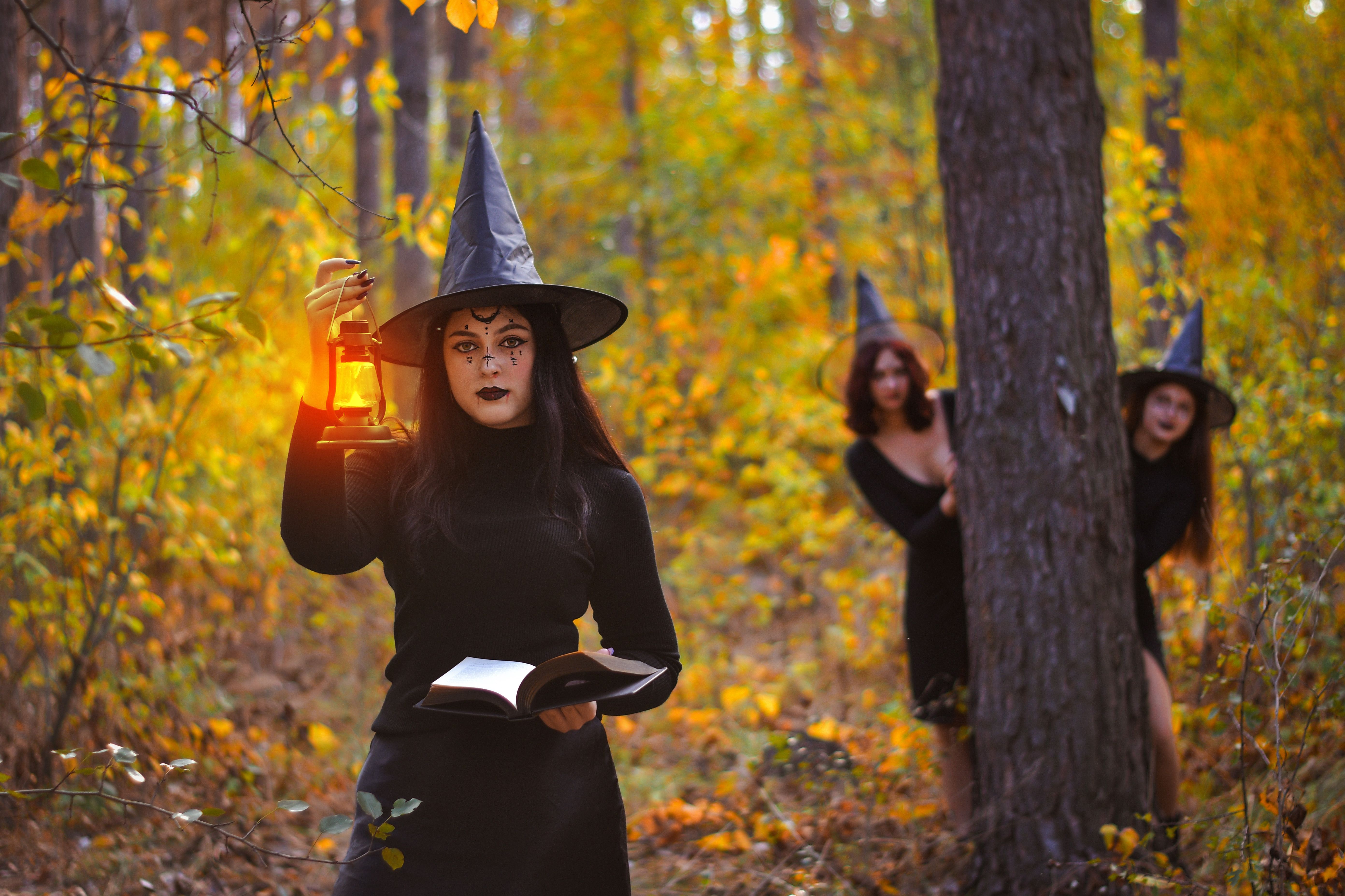 Enchanting Witch Trio in Autumn Forest · Free Stock Photo