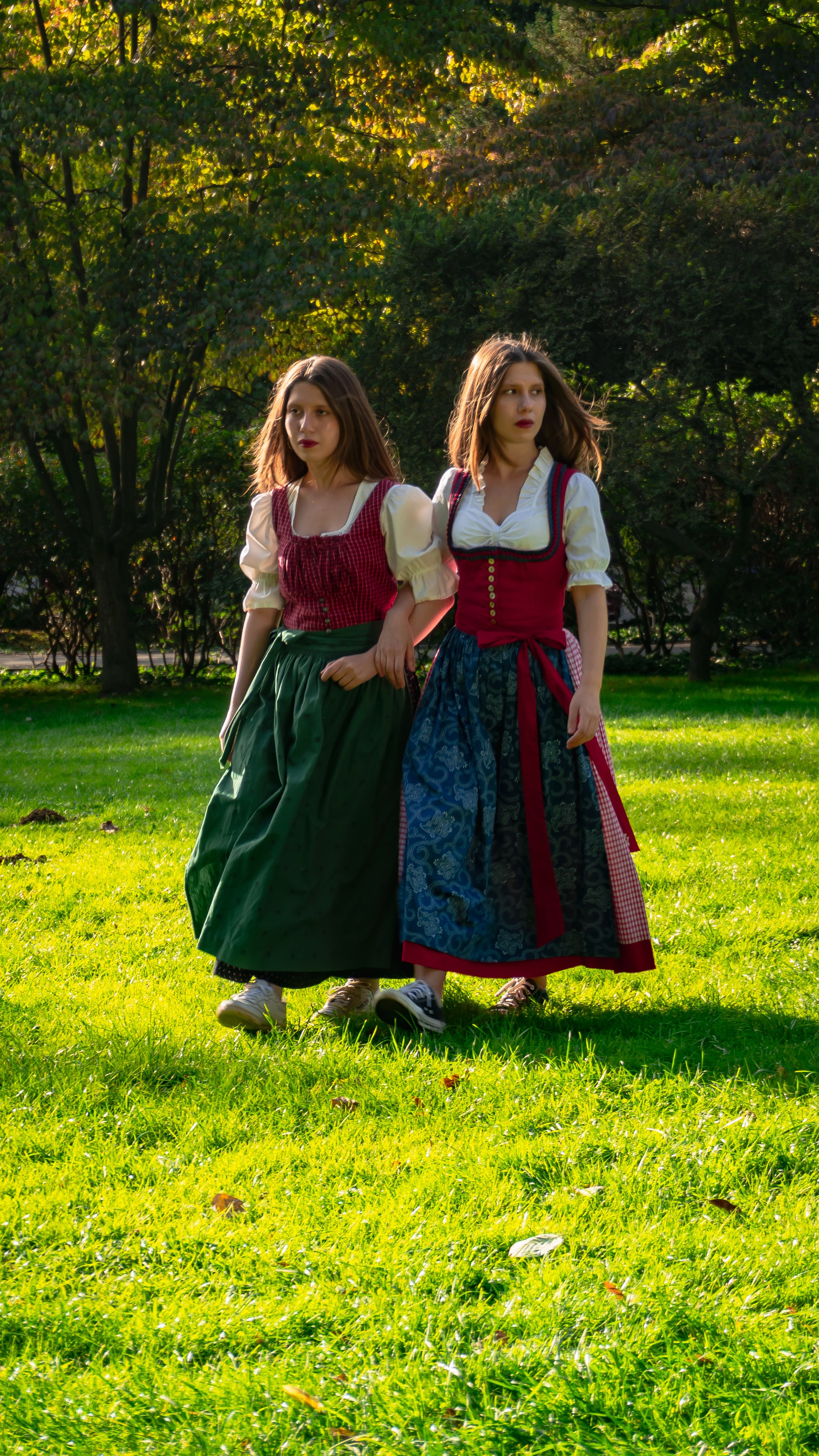 Young Women in Traditional Dirndl Dresses in Graz Park · Free Stock Photo