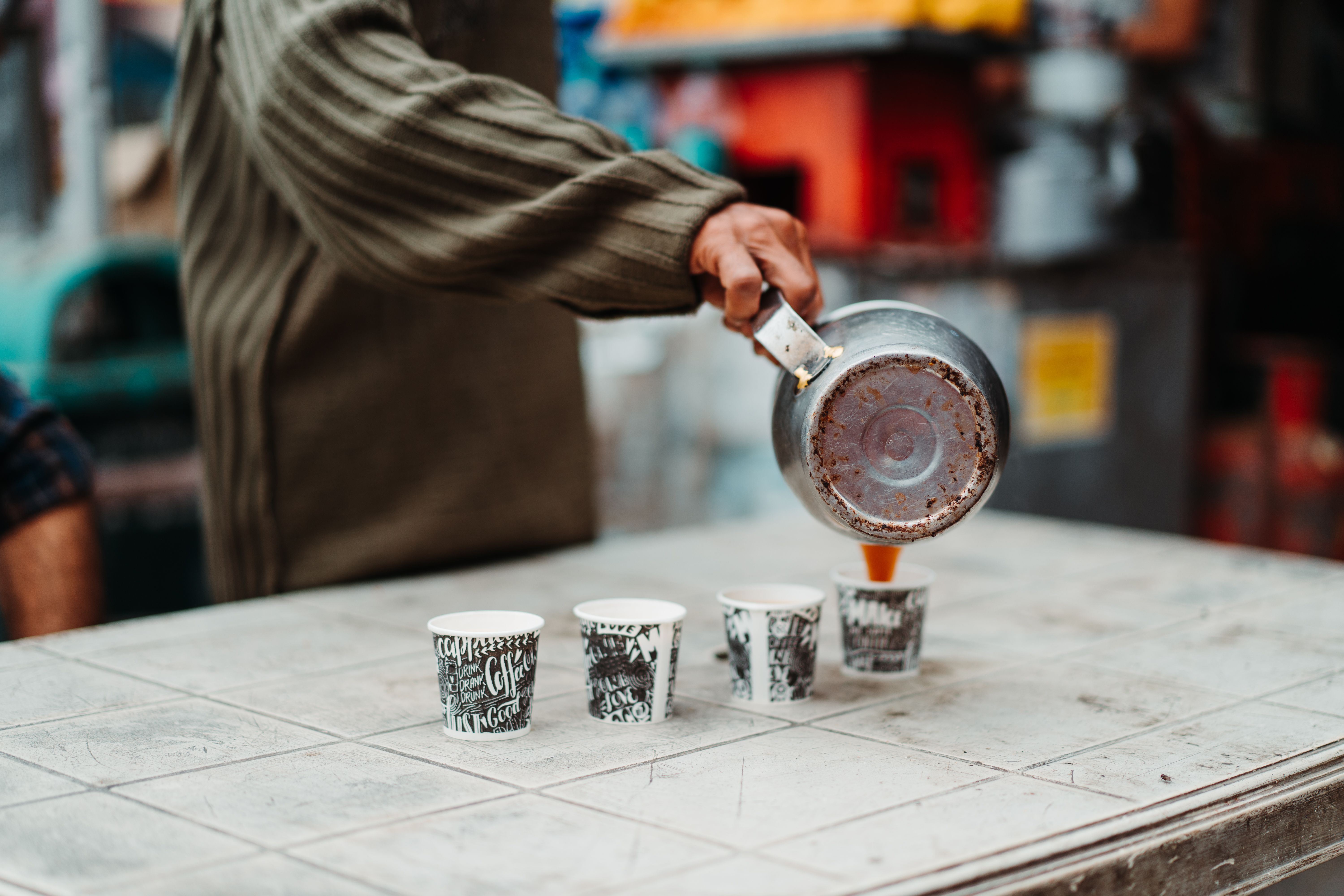 Person Pouring Coffee on a Mug · Free Stock Photo