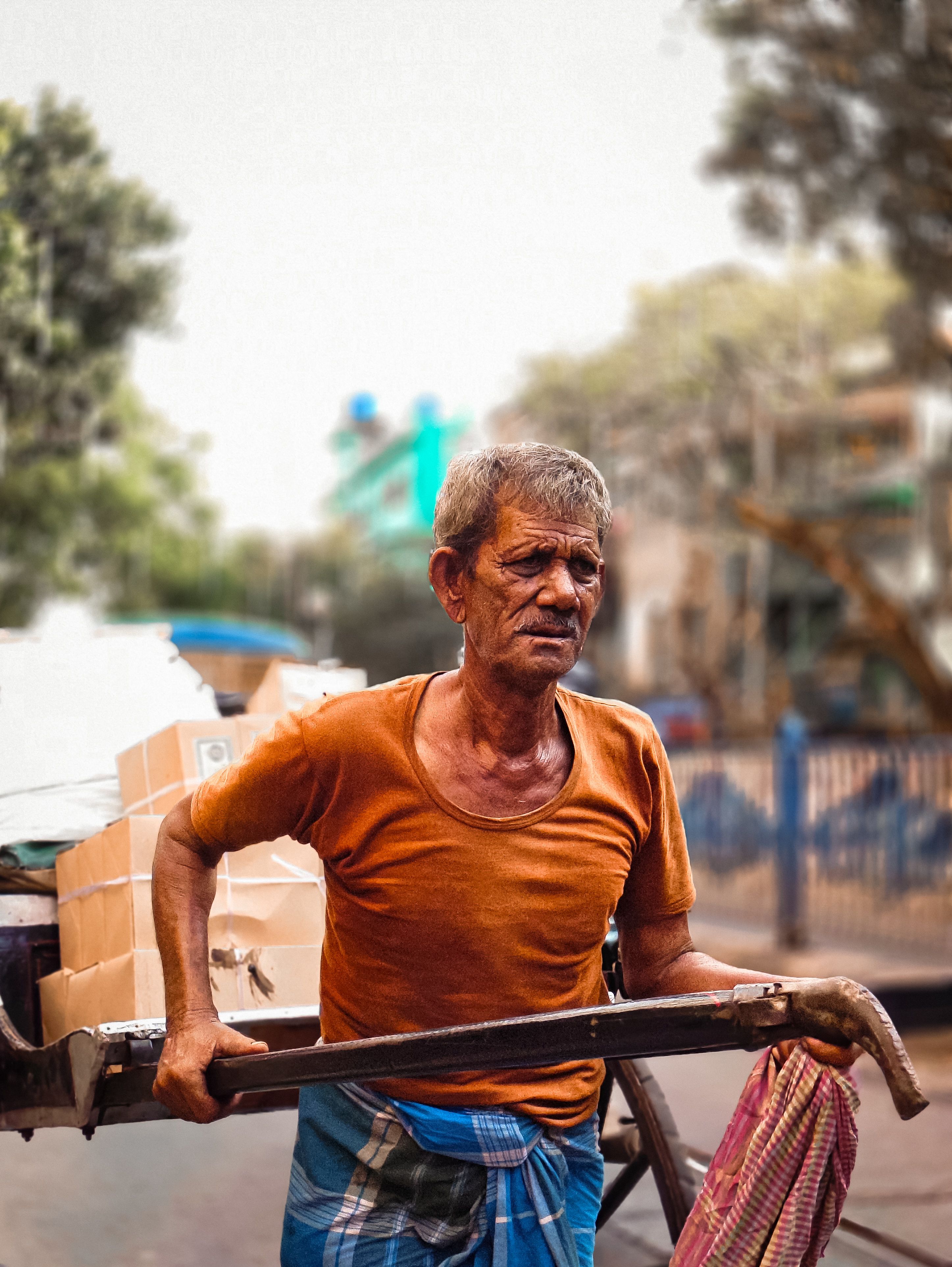 Elderly Man Pulling Loaded Cart on Street · Free Stock Photo