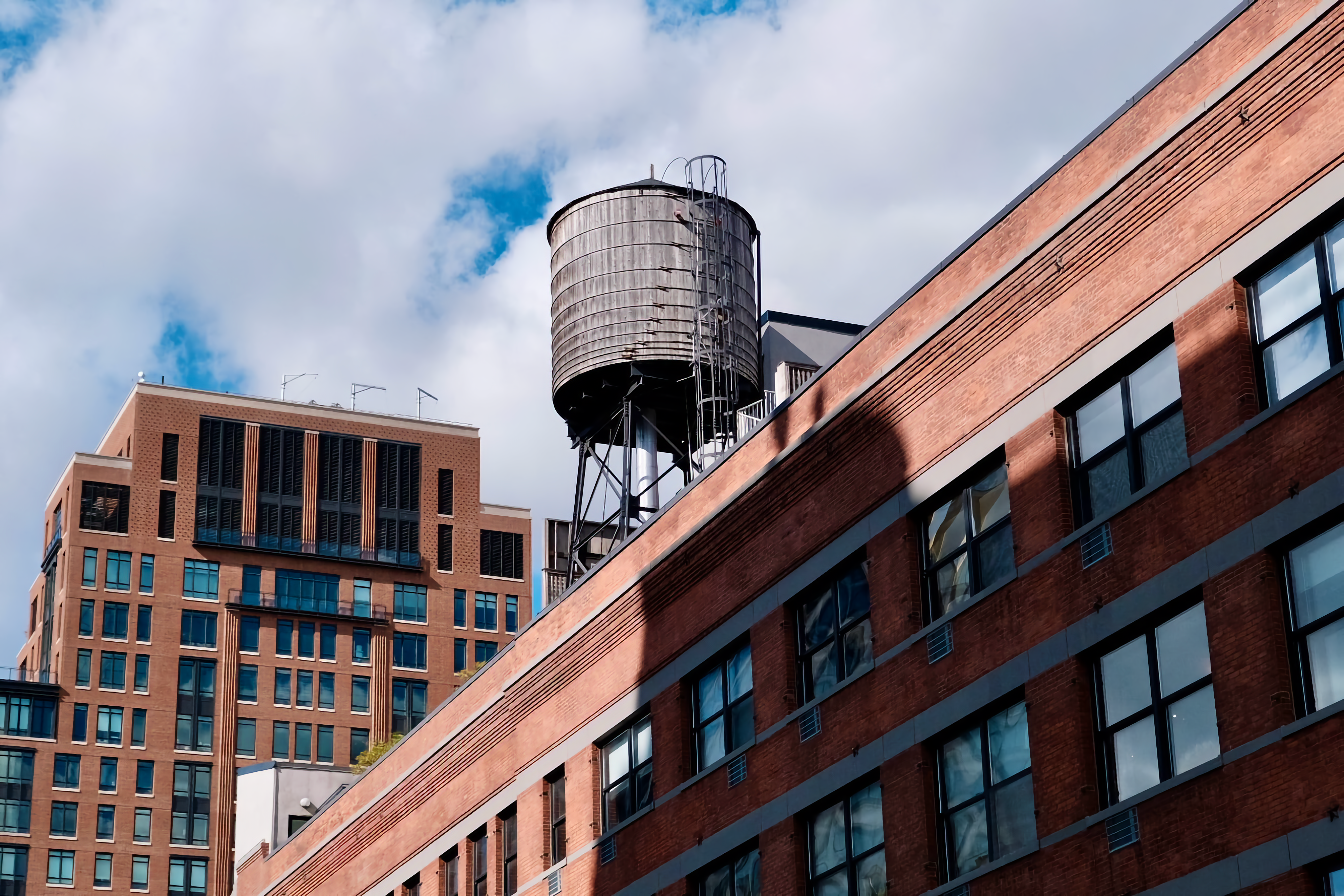 Water Tower Overlooking New York City Skyline · Free Stock Photo